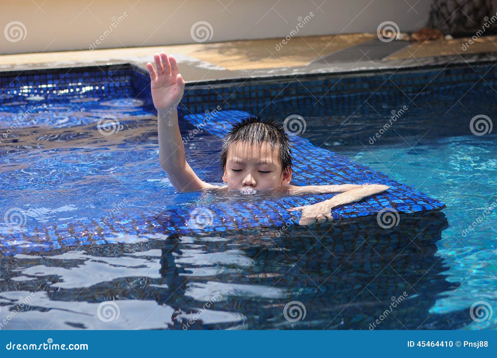 A boy blowing water stock photo. Image of sport, face - 45464410