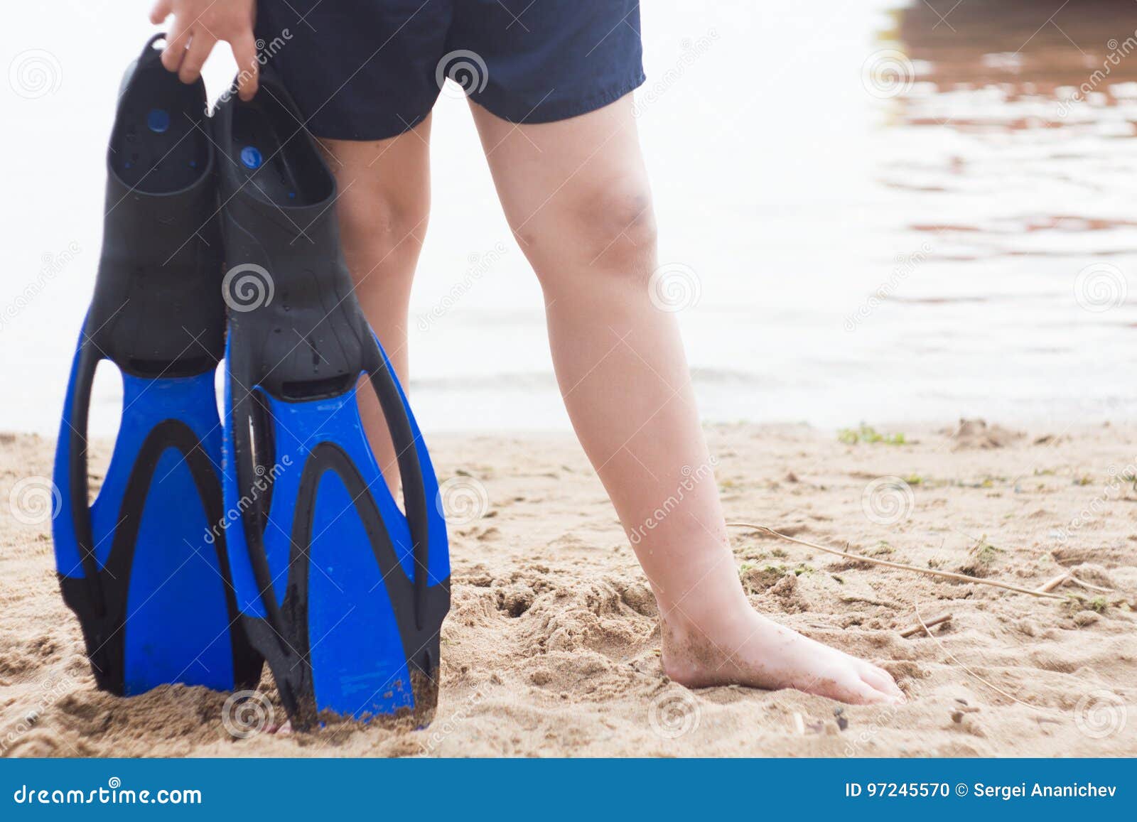 Boy in blue flipper stock photo. Image of blue, water - 97245570