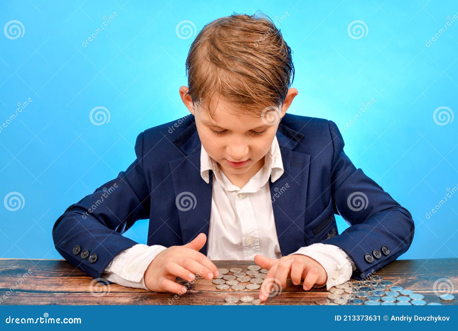 A Boy in a Blue Suit is Counting Money Stock Image - Image of count ...