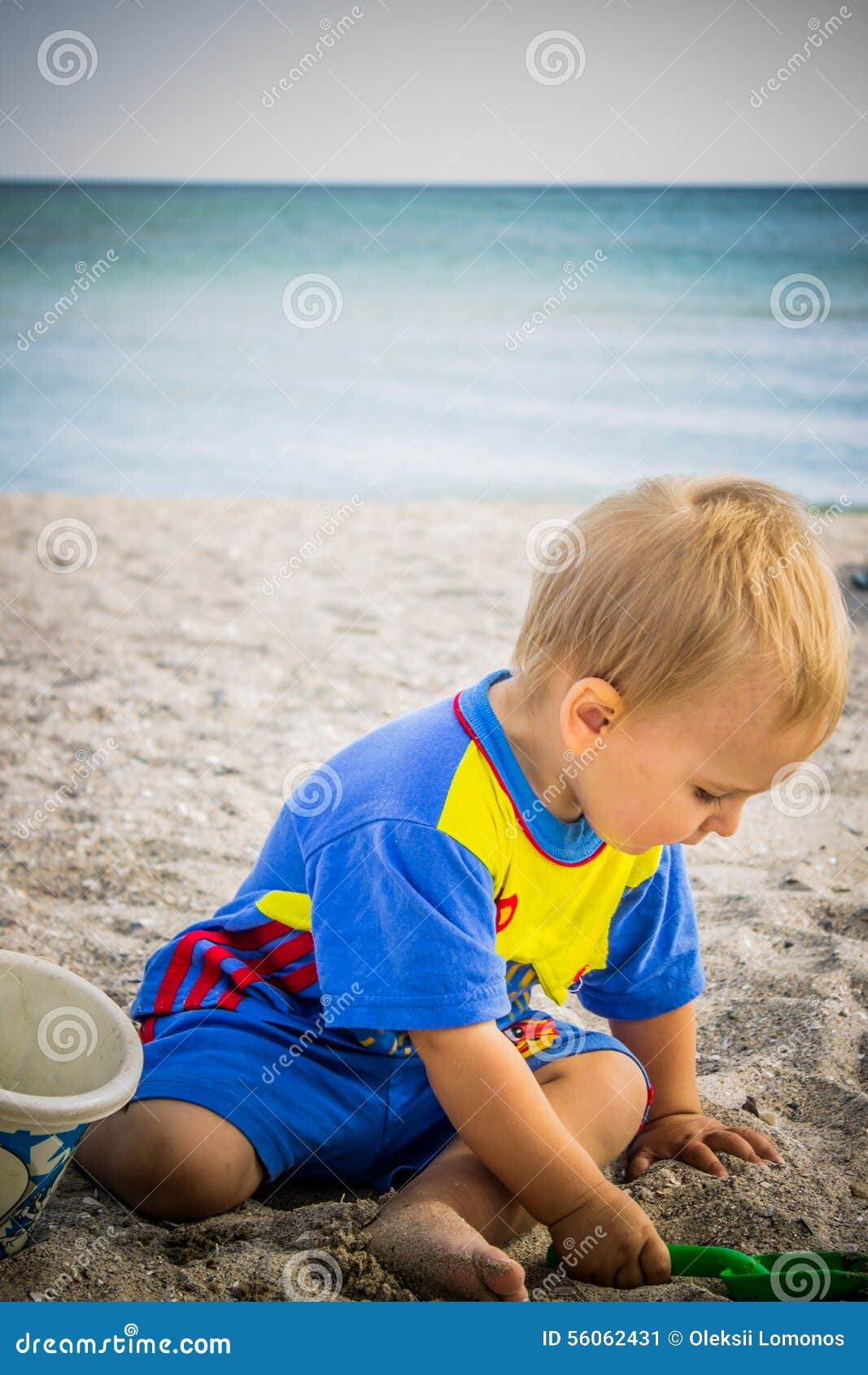A Boy in a Blue Suit Played on the Beach Stock Image - Image of builder ...