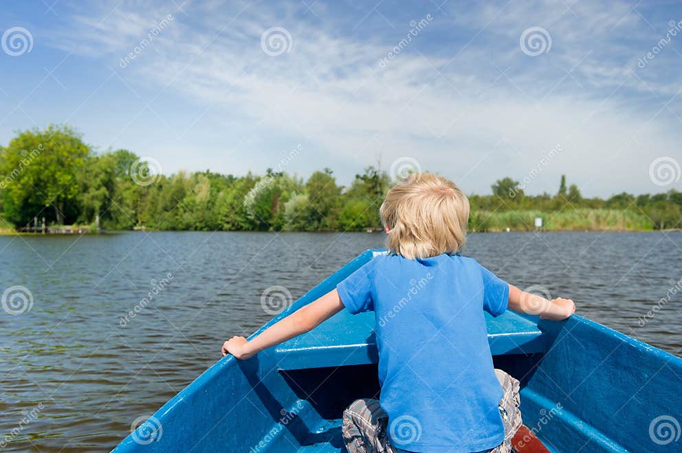 Boy in boat stock photo. Image of landscape, back, nature - 20735010