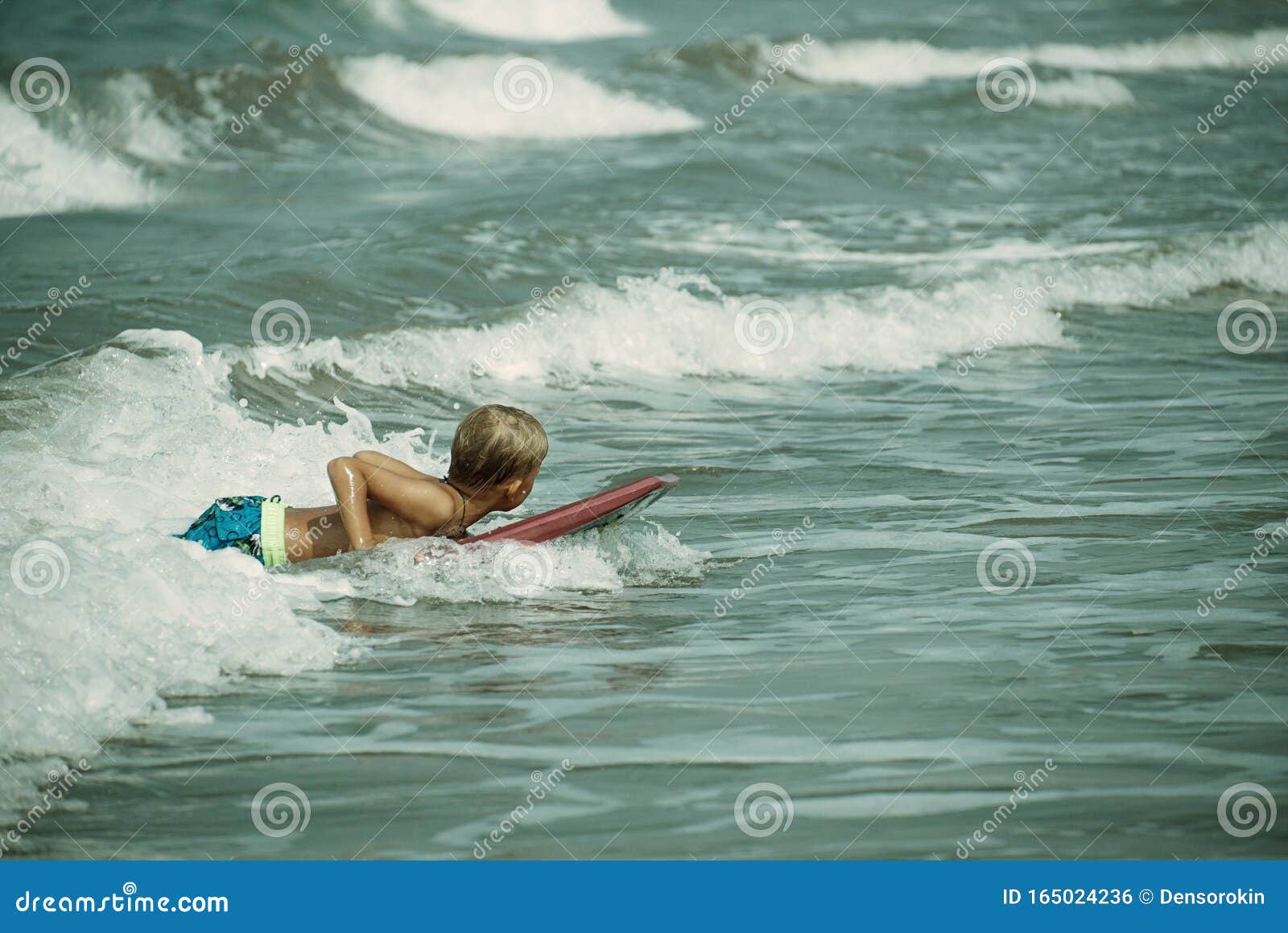 Boy on bodyboard stock photo. Image of swimming, power - 165024236
