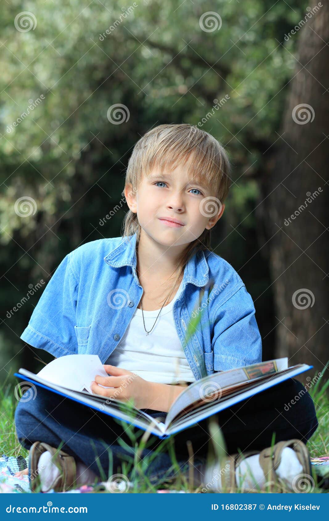 Boy with book stock image. Image of grass, person, forest - 16802387