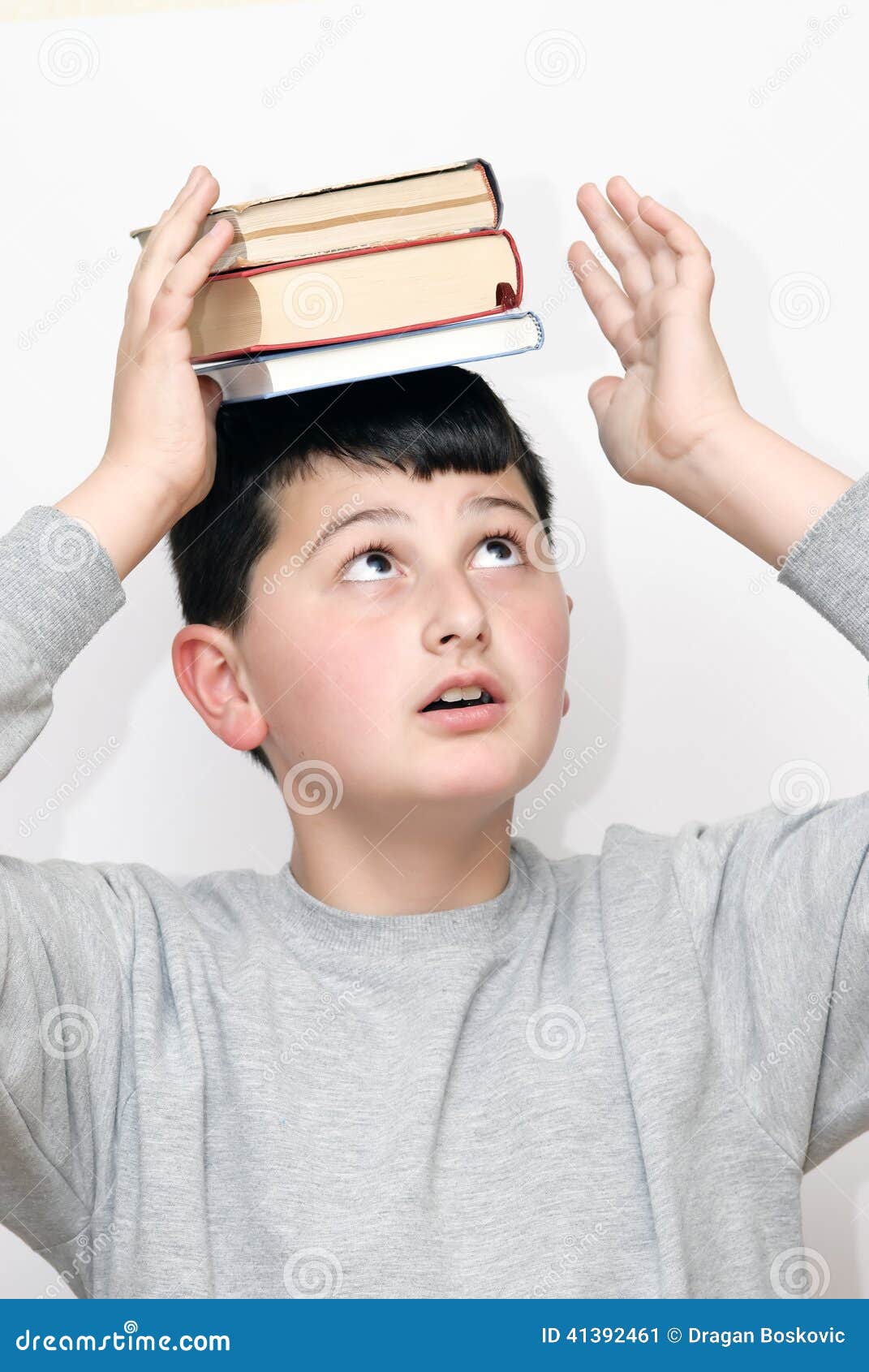 Boy with a Book on His Head Stock Image - Image of diligent, portrait ...