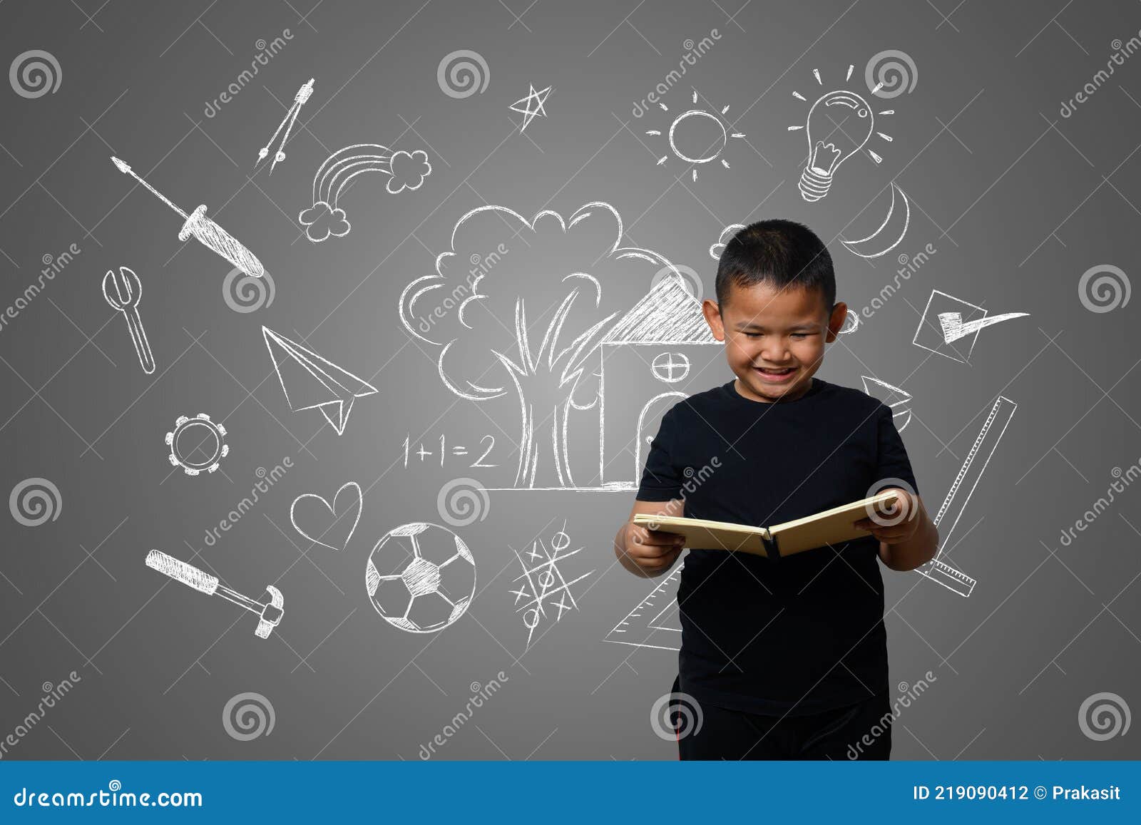 A Boy and a Book of Knowledge on the Blackboard Background Stock Photo ...
