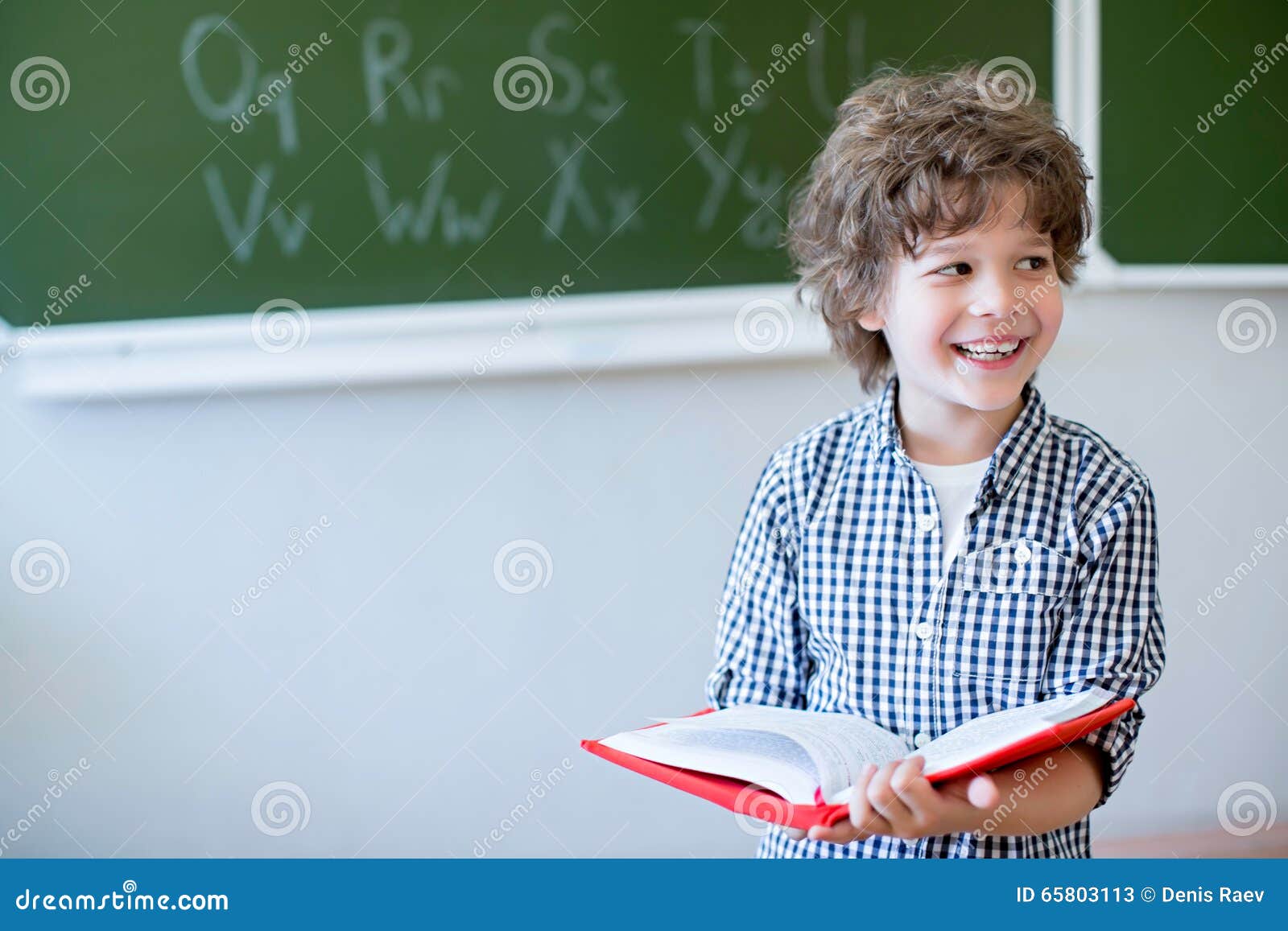Boy with book stock image. Image of child, happiness - 65803113