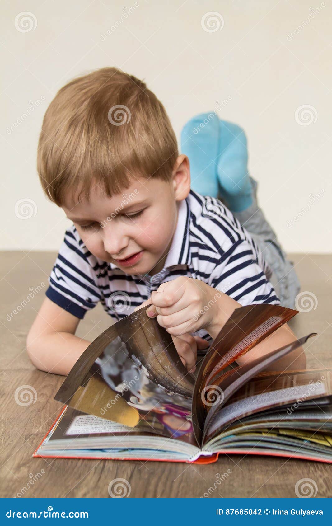 Boy with a book stock photo. Image of book, flipping - 87685042
