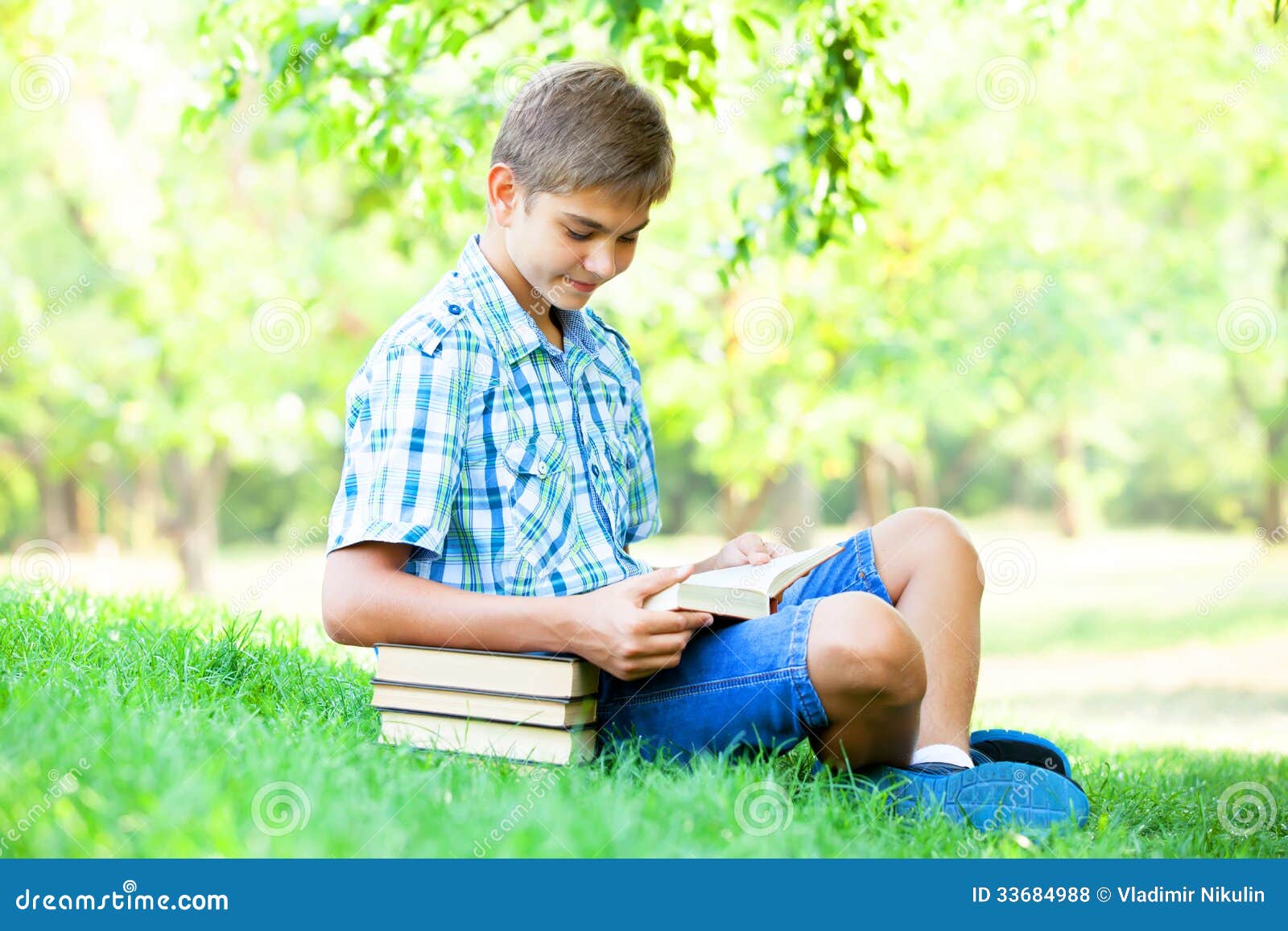Boy with books stock photo. Image of laying, schoolboy - 33684988