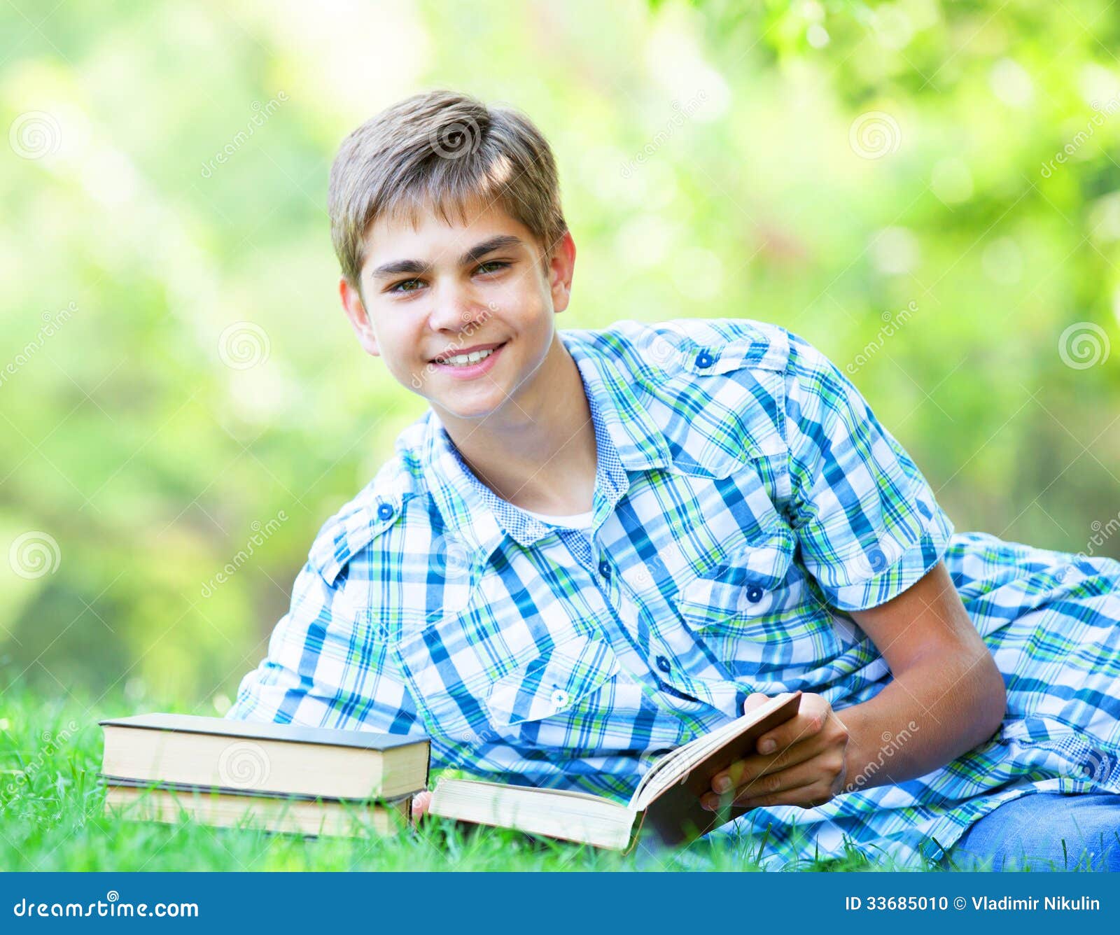 Boy with books stock photo. Image of lawn, male, reading - 33685010
