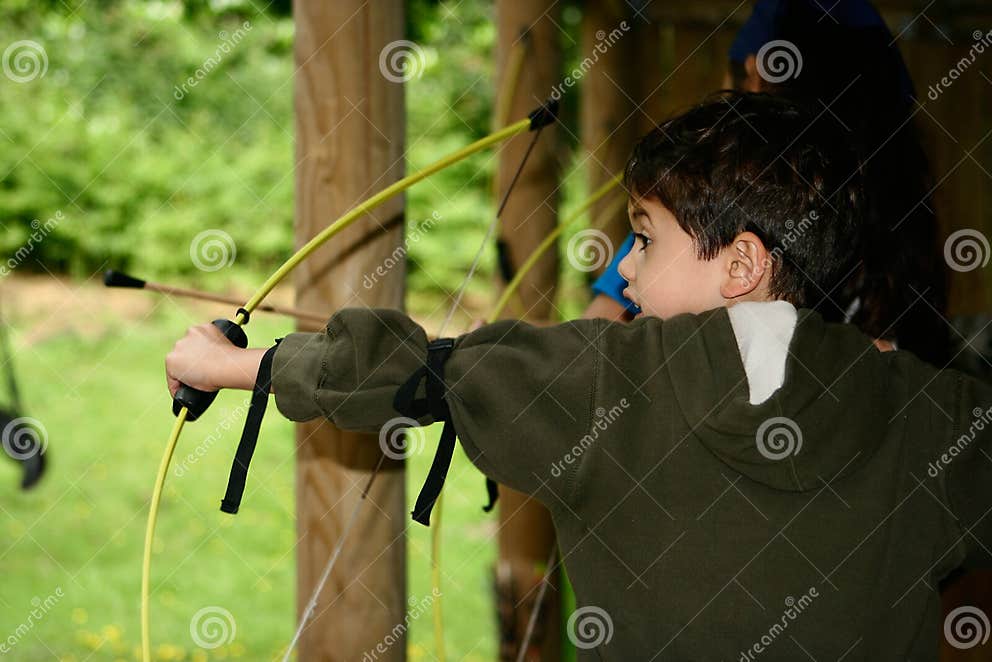 Boy with bow and arrow stock image. Image of coordination - 2636743