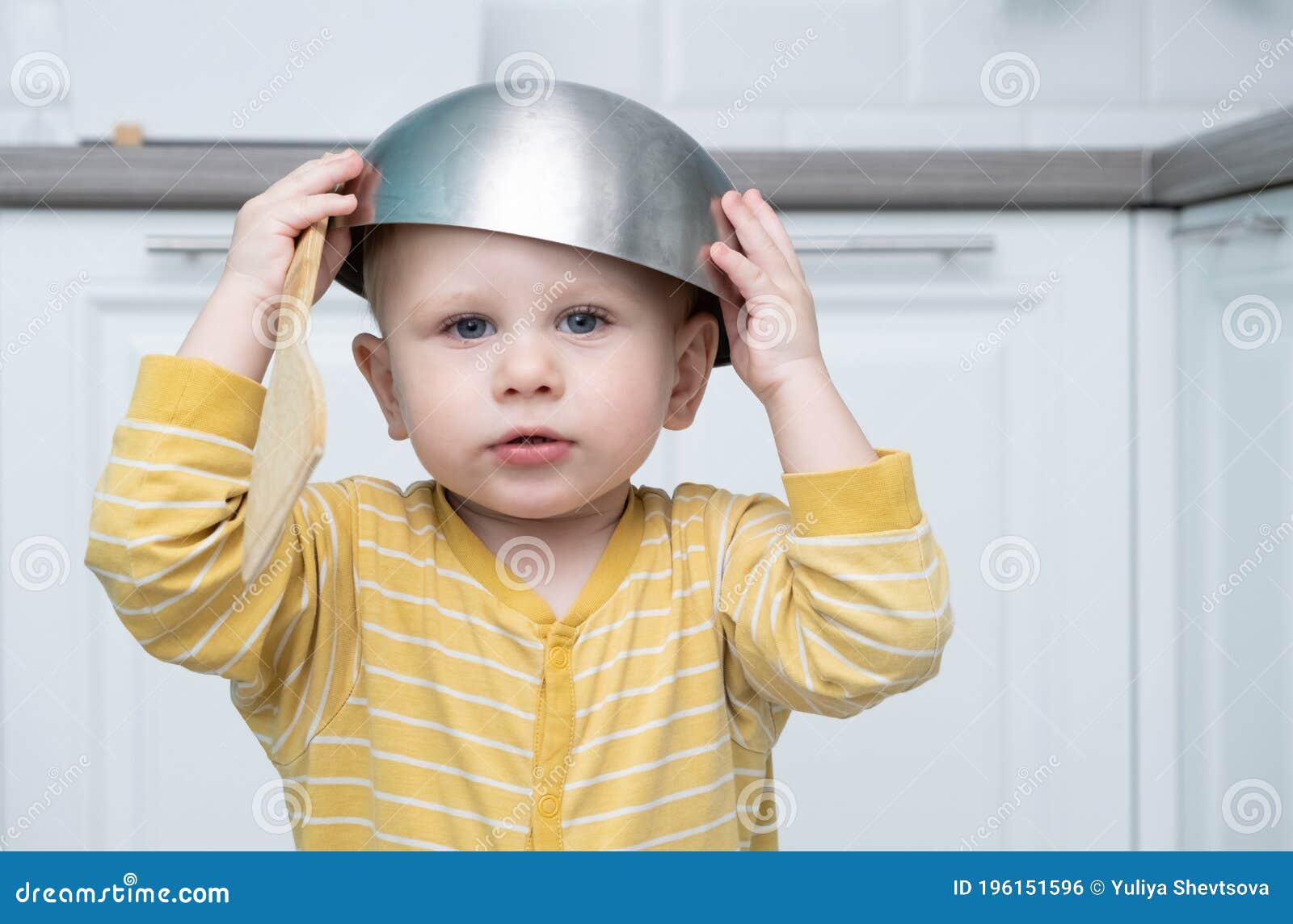 Boy with a Bowl on His Head. Games in the Kitchen. Stock Photo - Image ...