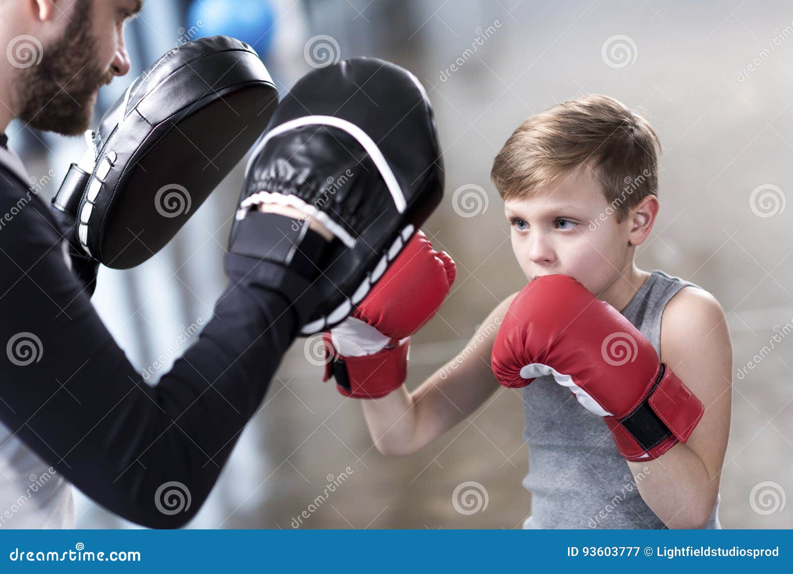 Boxer Practicing Her Punches At A Boxing Studio. Close Up Of A Male ...