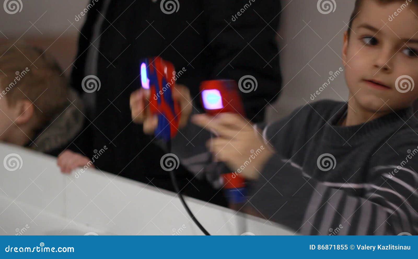 Boy Boxing with Gamepad in Hands. Kid Remote Controlling Robot Stock ...