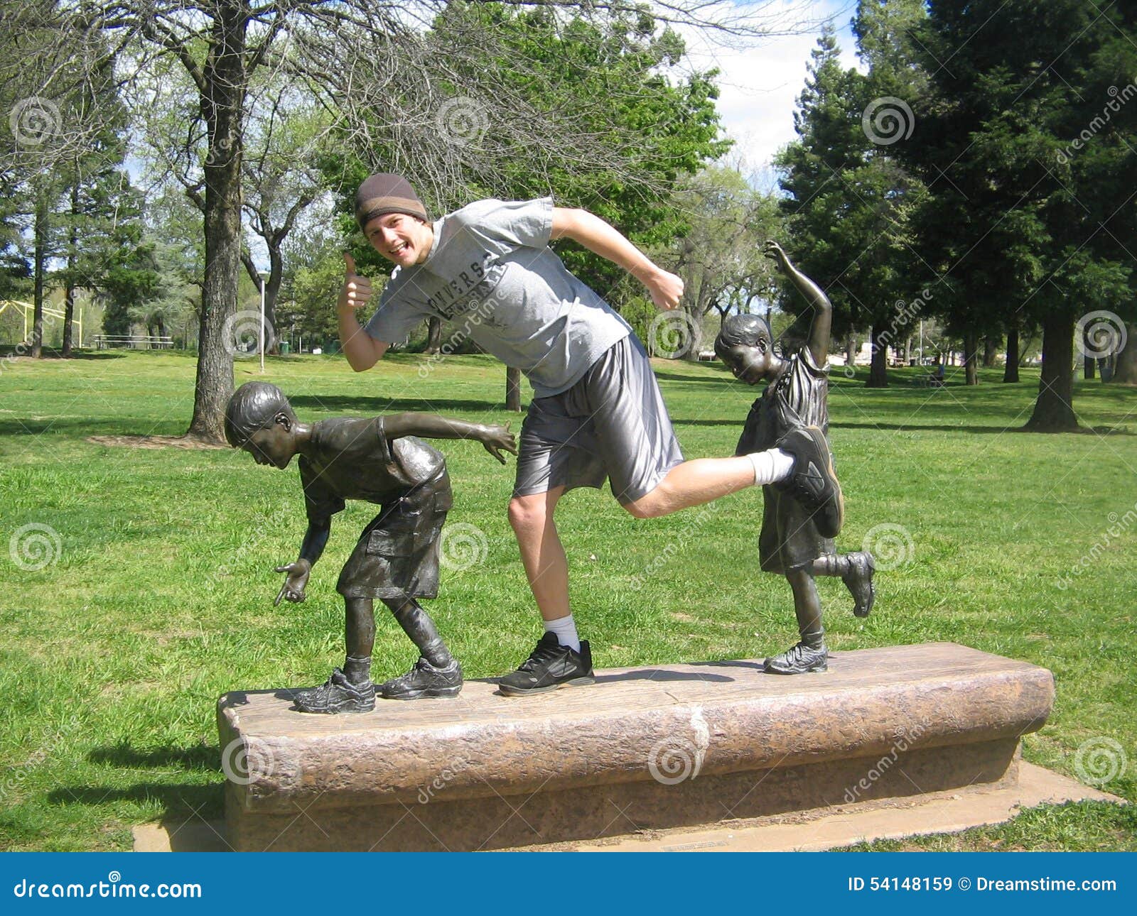 Boy with Boys Statues in Redding, California Park Editorial Stock Image ...