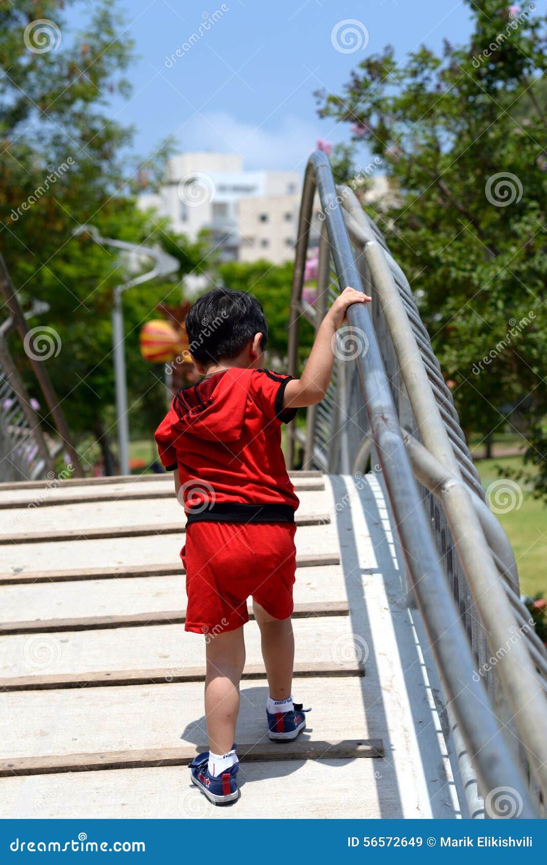 Little boy on bridge stock image. Image of park, garden - 56572649