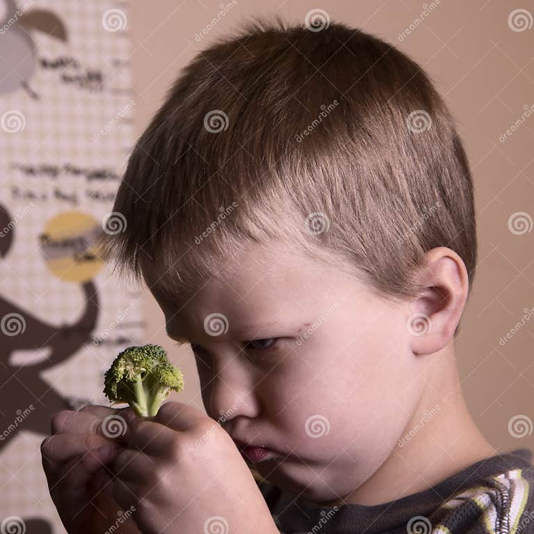 Boy with broccoli stock photo. Image of food, yuck, portrait - 95972254