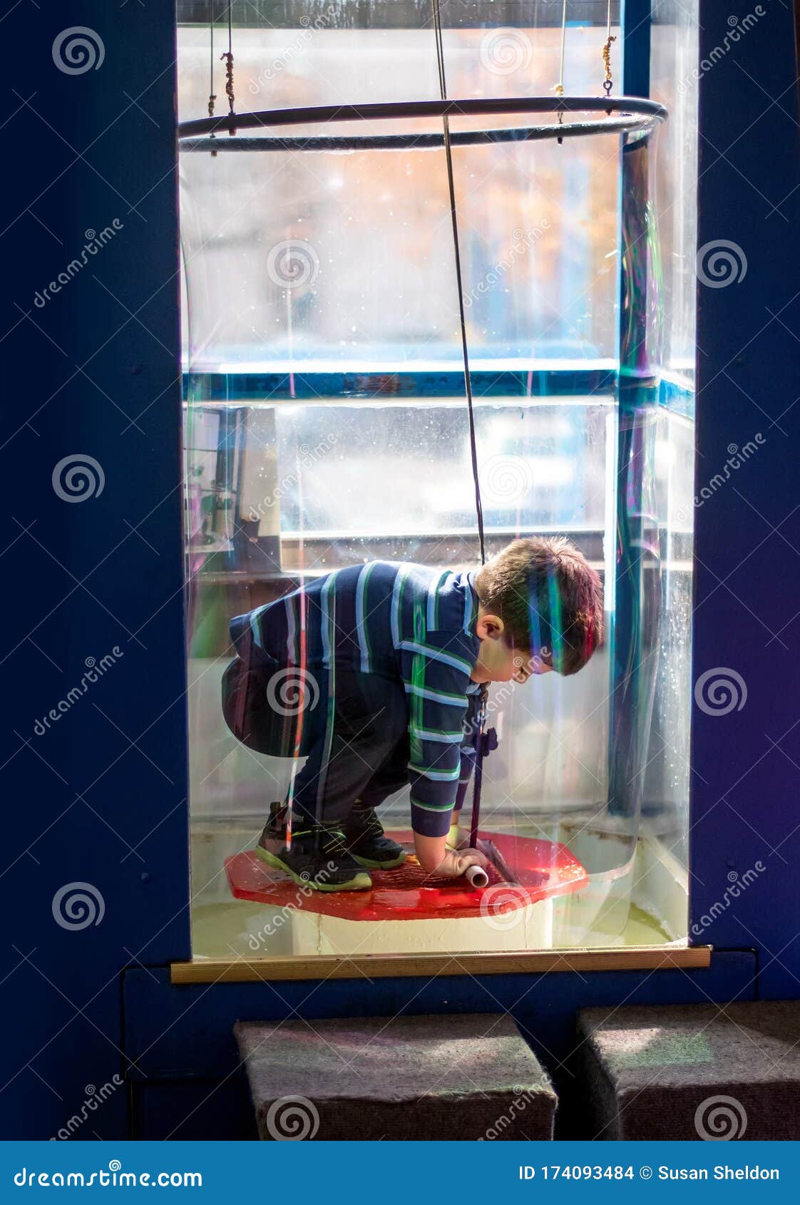 Boy inside a giant bubble stock photo. Image of idea - 174093484
