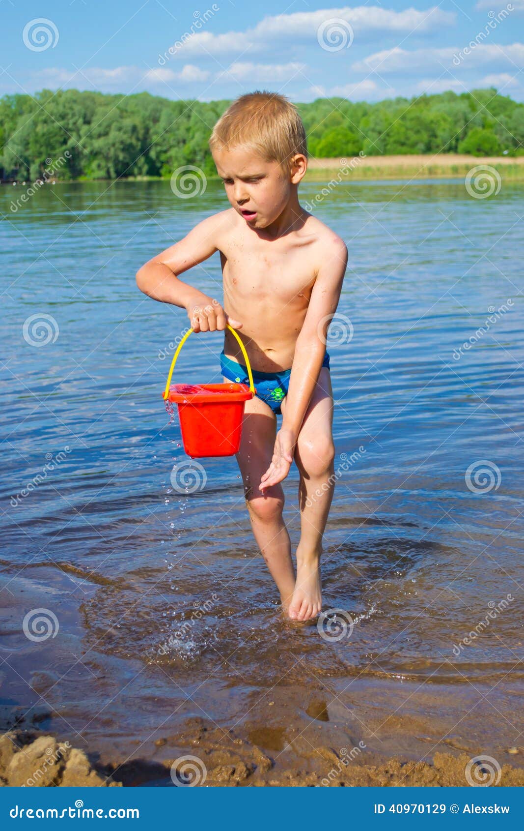 Boy with a bucket of water stock image. Image of beautiful - 40970129