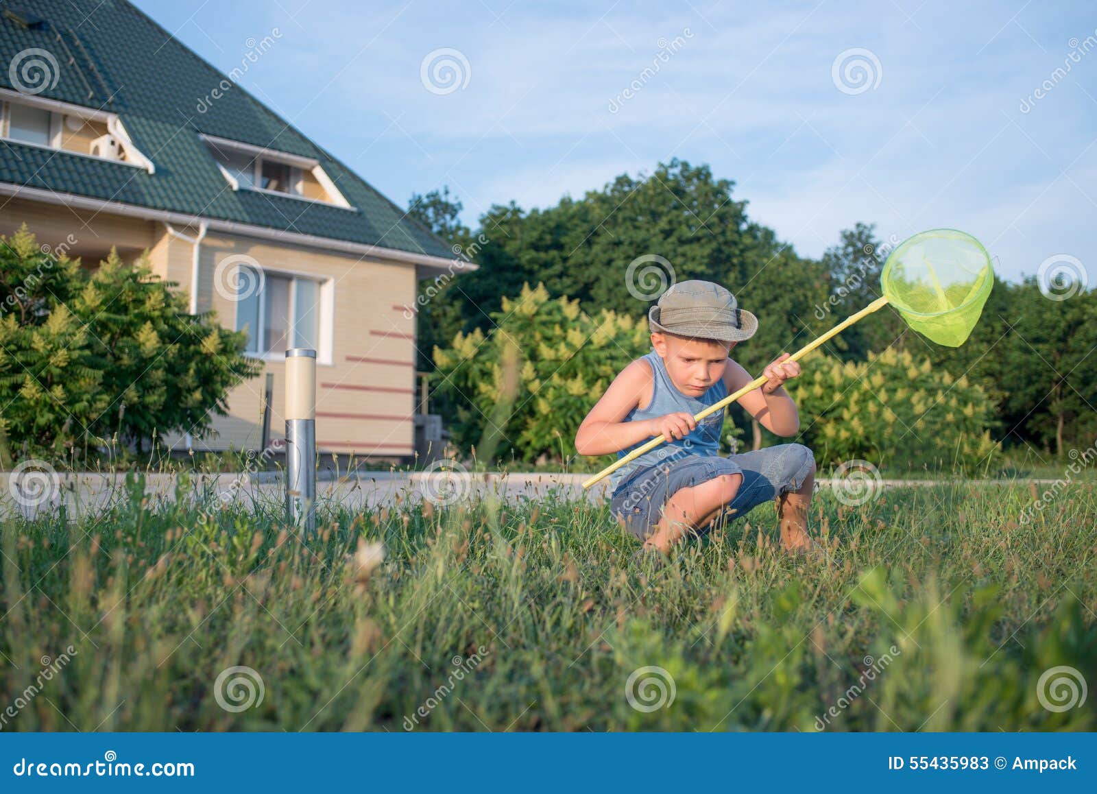 Boy with Bug Net Crouching in Long Grass on Lawn Stock Image - Image of ...