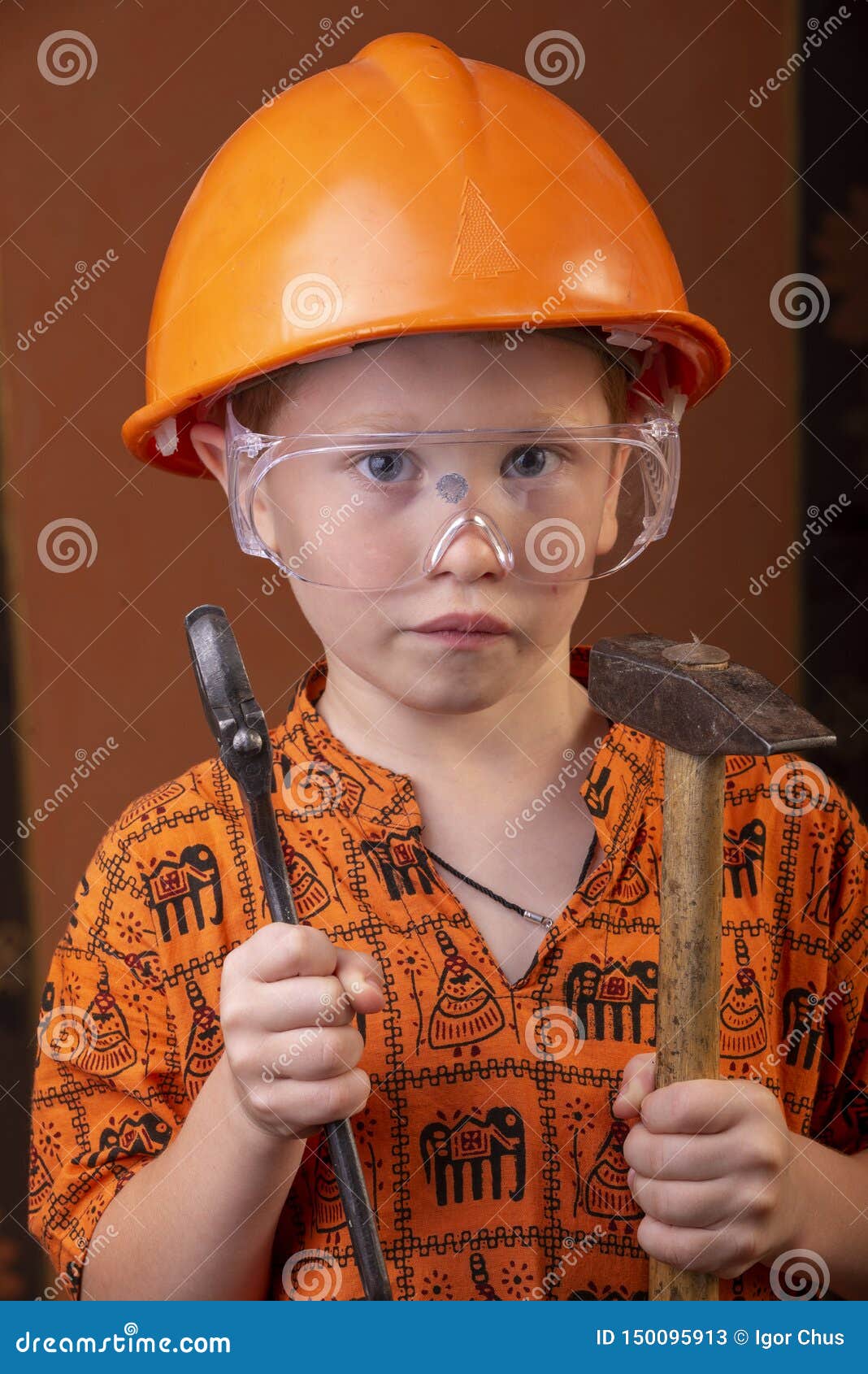 Boy in builder`s clothes stock image. Image of contractor - 150095913