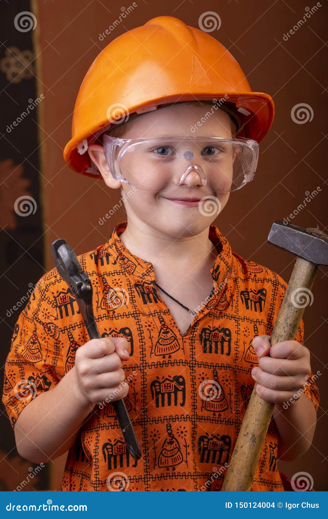 Boy in builder`s clothes stock photo. Image of business - 150124004