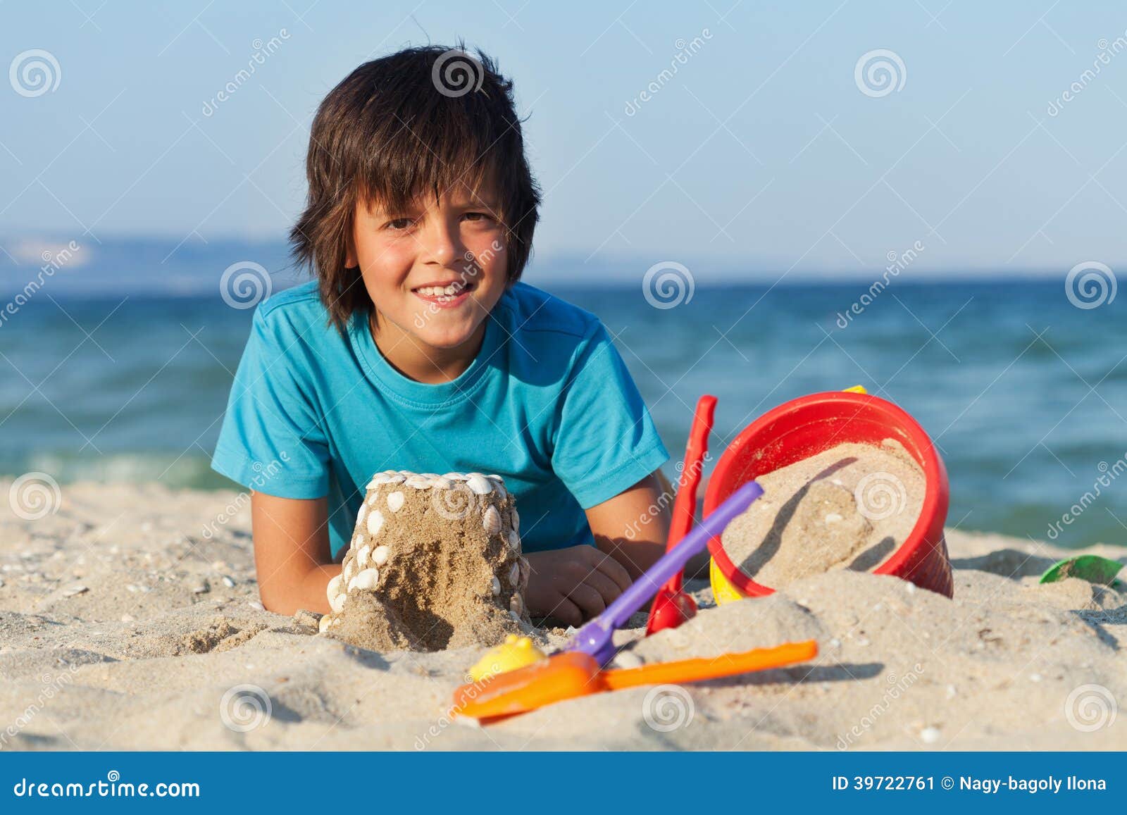 Boy Building Sand Castles on the Sea Shore Stock Image - Image of ...