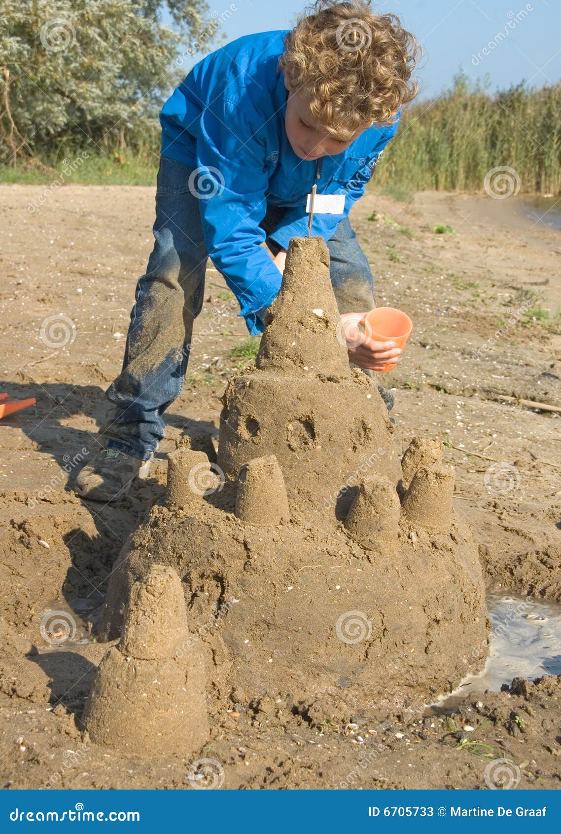 Boy Building Sandcastle stock image. Image of playing - 6705733