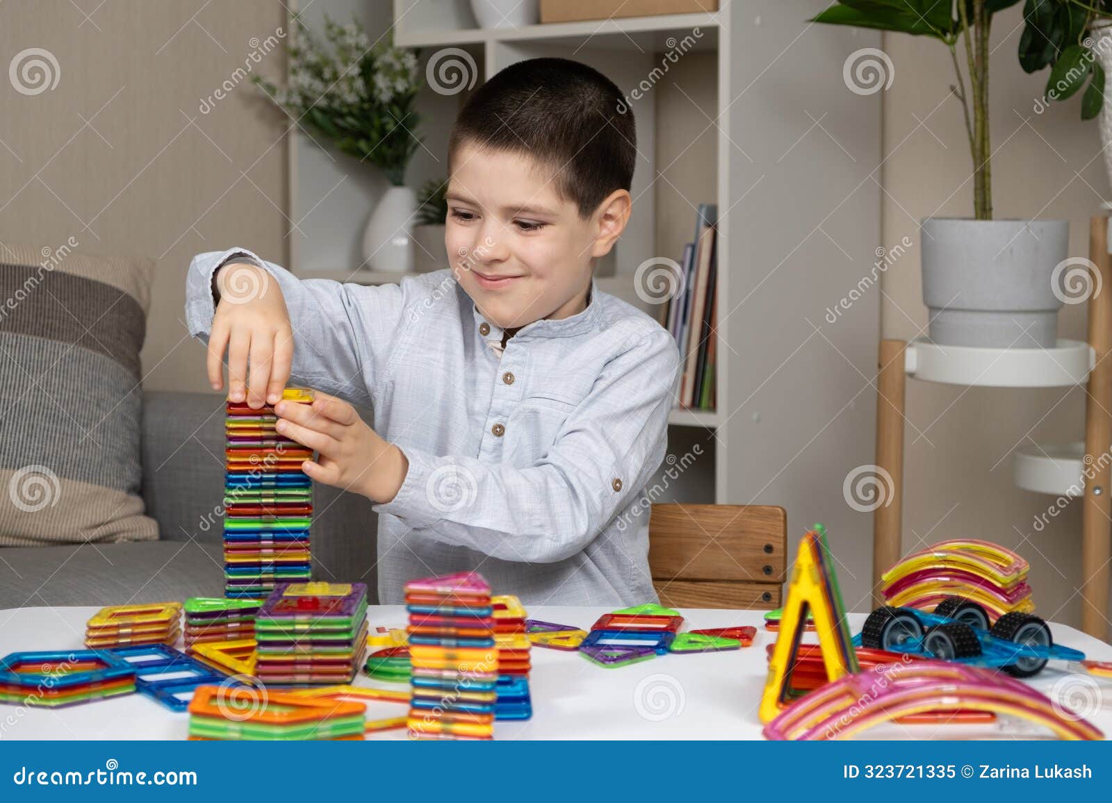 Boy Building a Tower from a Magnetic Construction Set Stock Image ...