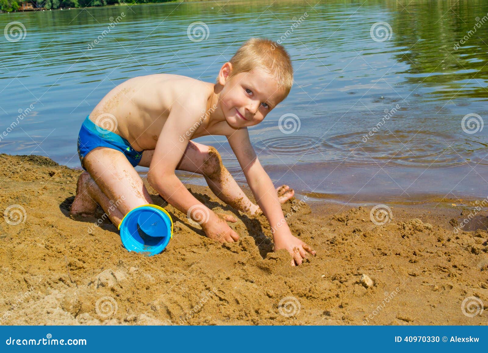 Boy Builds A Sand Stock Image | CartoonDealer.com #40970275