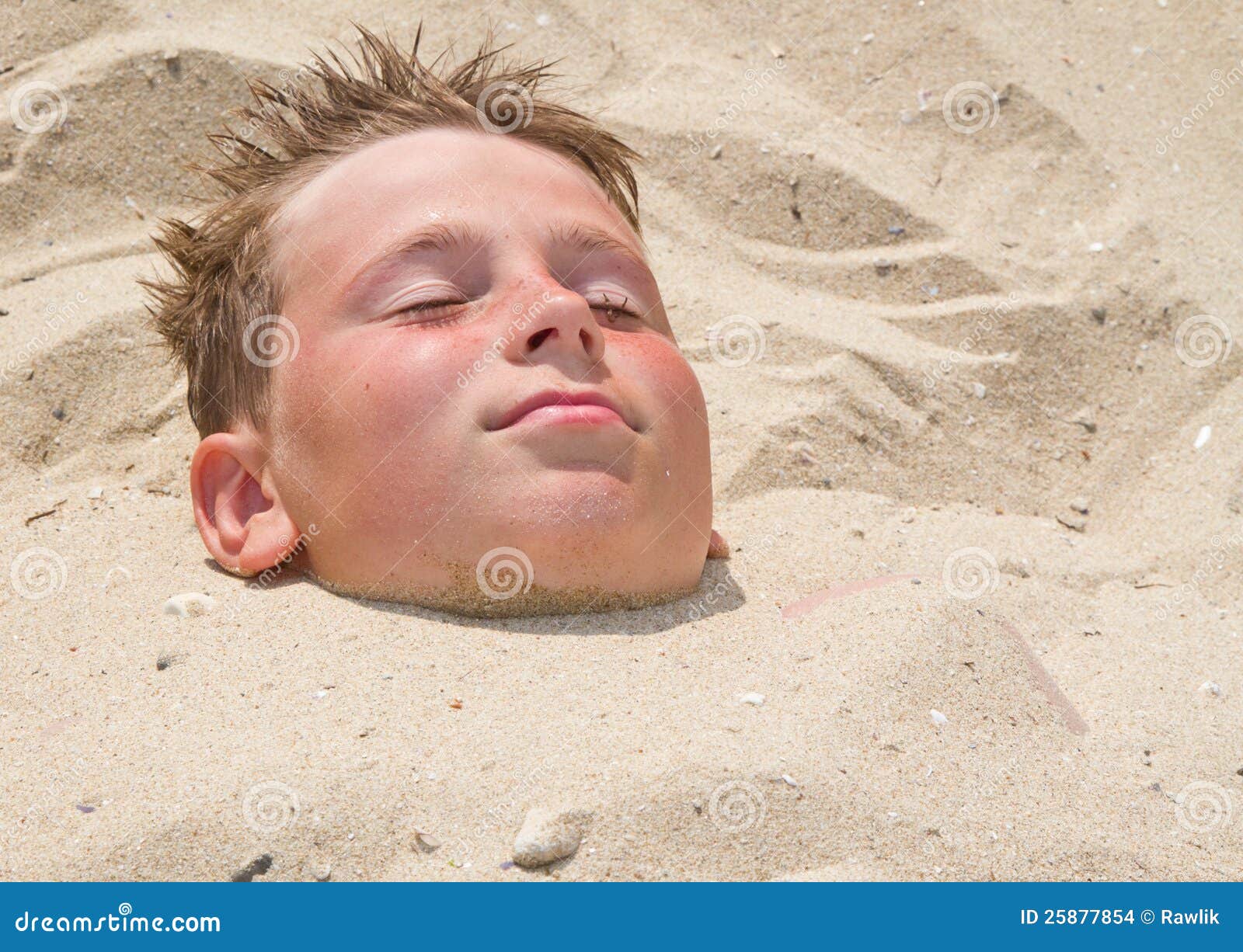 Boy Buried In Sand Stock Images - Image: 25877854