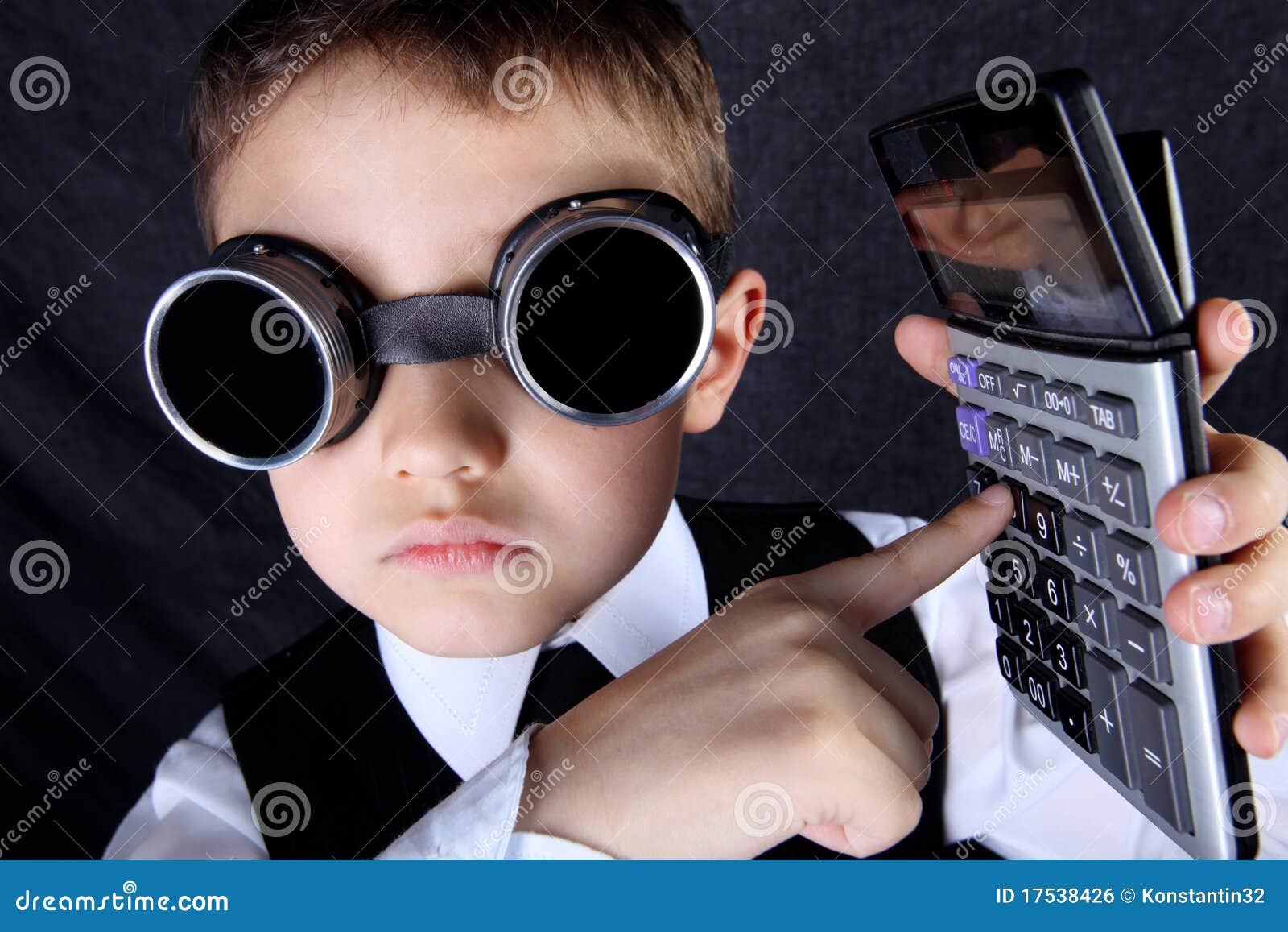 Boy with calculator stock photo. Image of fingers, face - 17538426