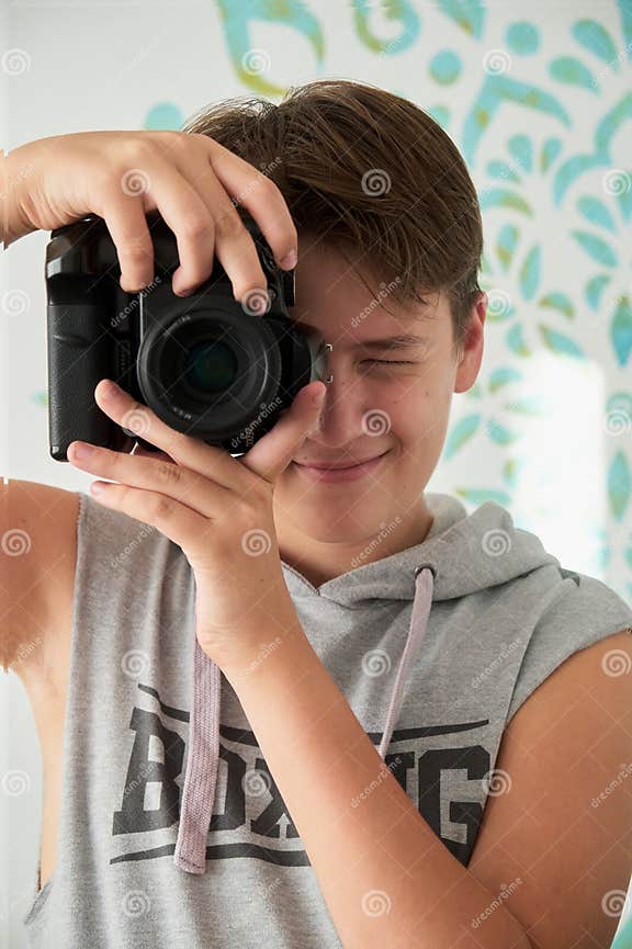 A Boy with Camera in His Hands Stock Photo - Image of camera, model ...