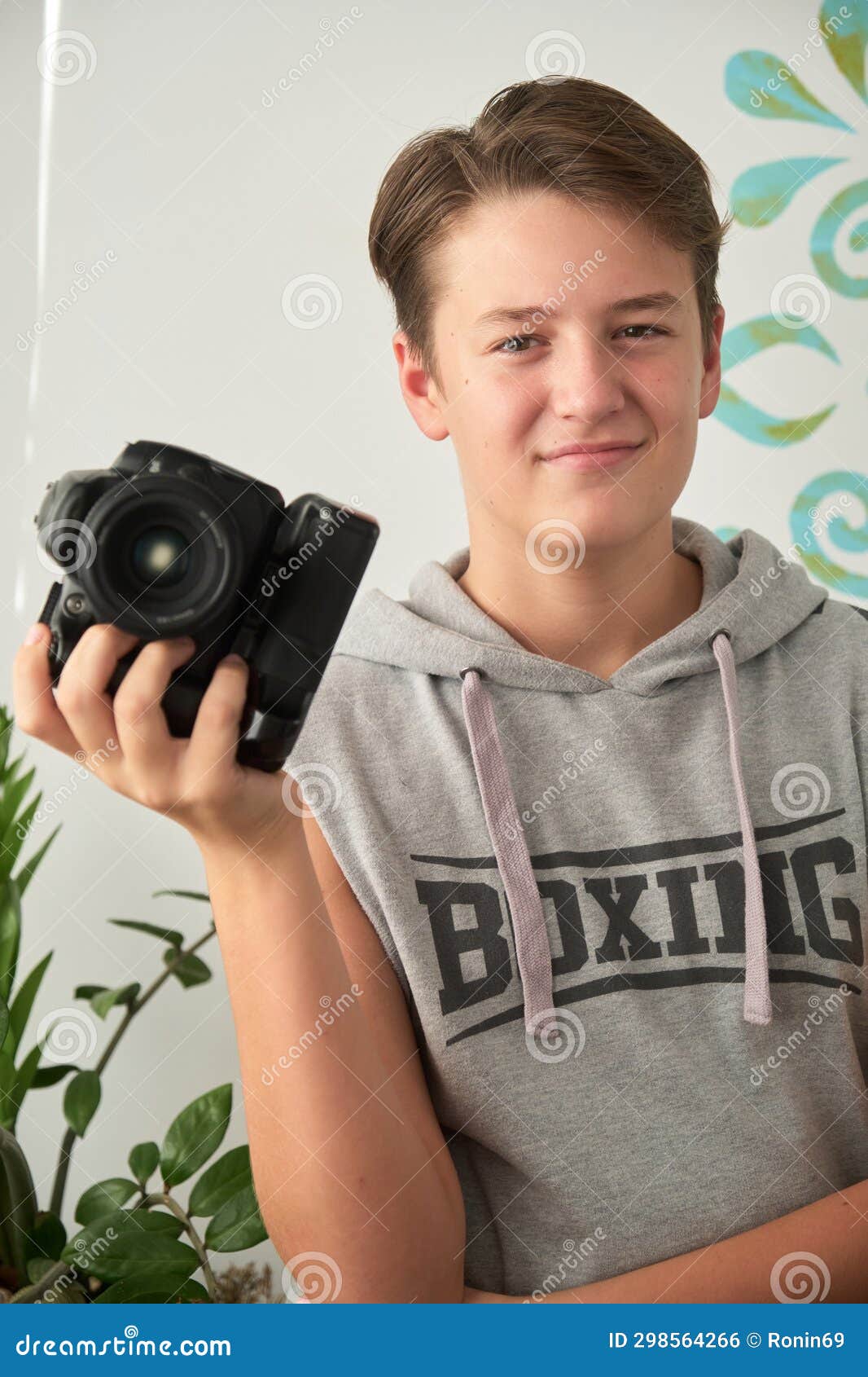 A Boy with Camera in His Hands Stock Photo - Image of pose, standing ...
