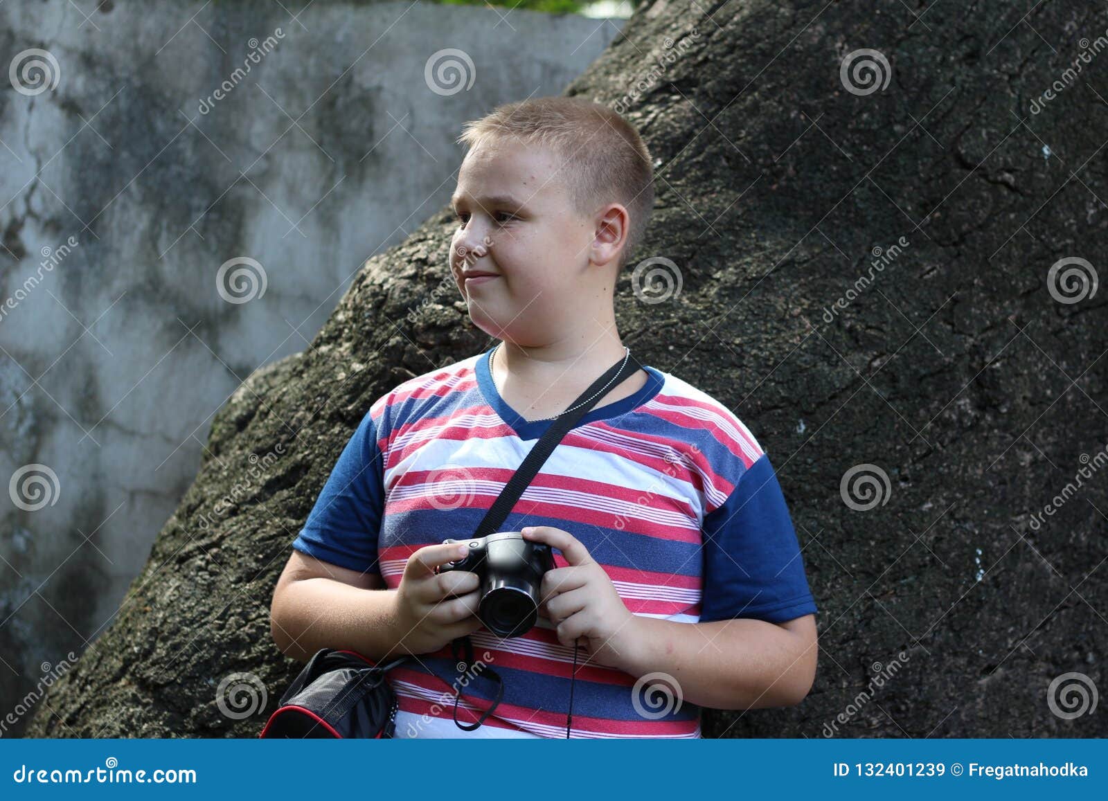 Boy with a camera stock image. Image of smiling, teen - 132401239