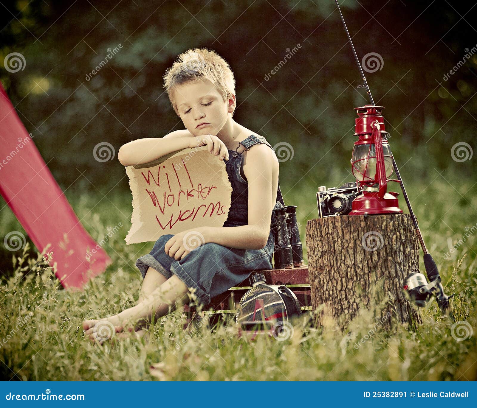 Boy camping in countryside stock image. Image of resting - 25382891