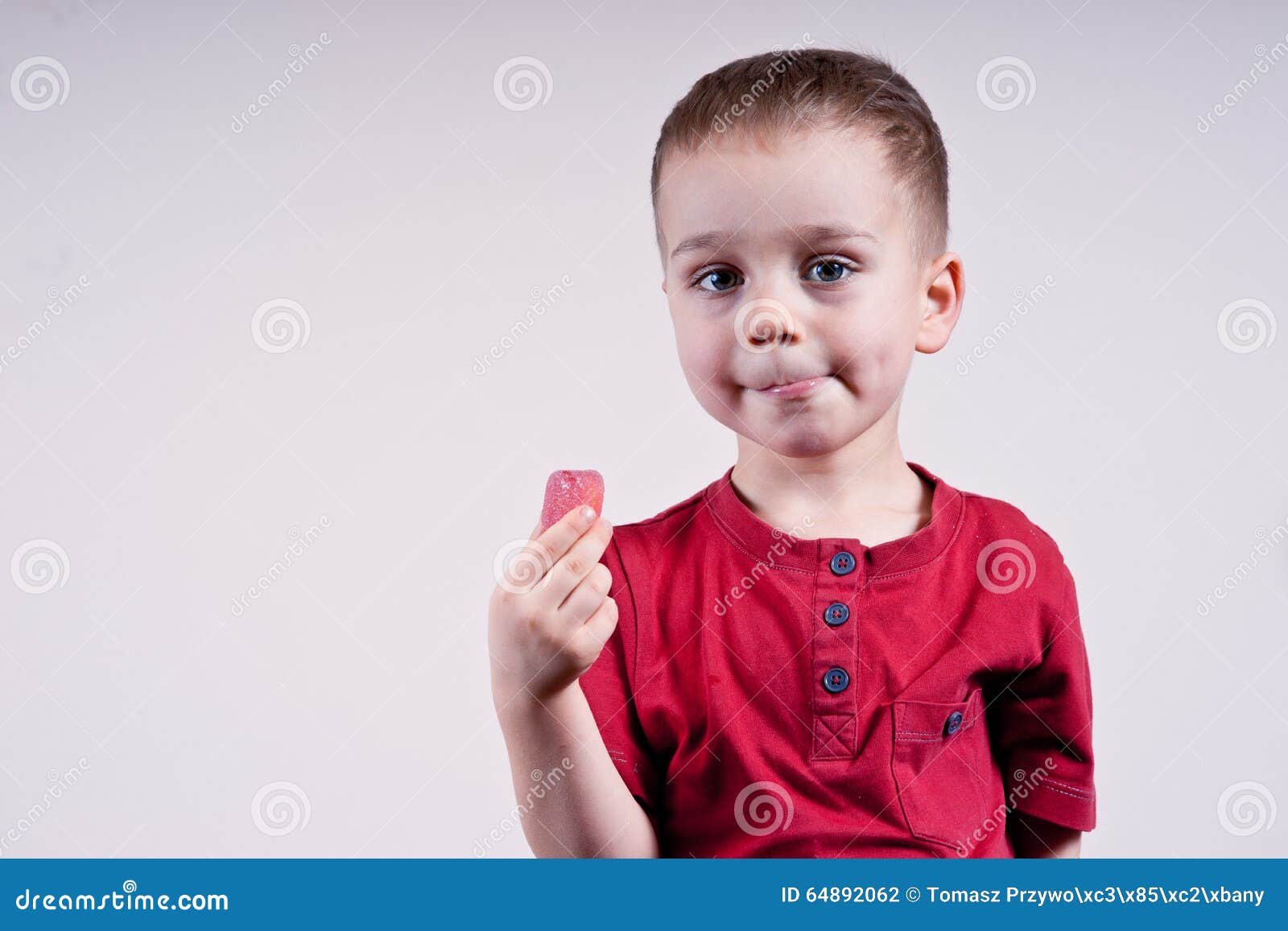 Boy with candy stock photo. Image of white, portrait - 64892062