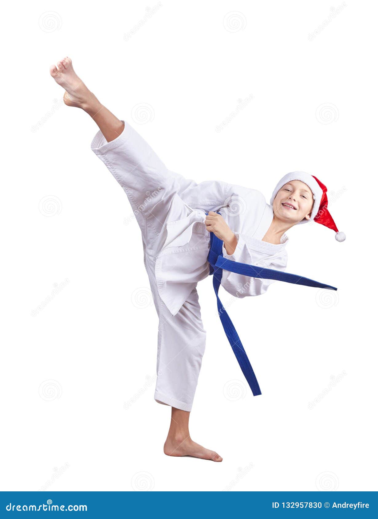 Boy in a Cap of Santa Claus Beats a High Kick Leg Stock Photo - Image ...