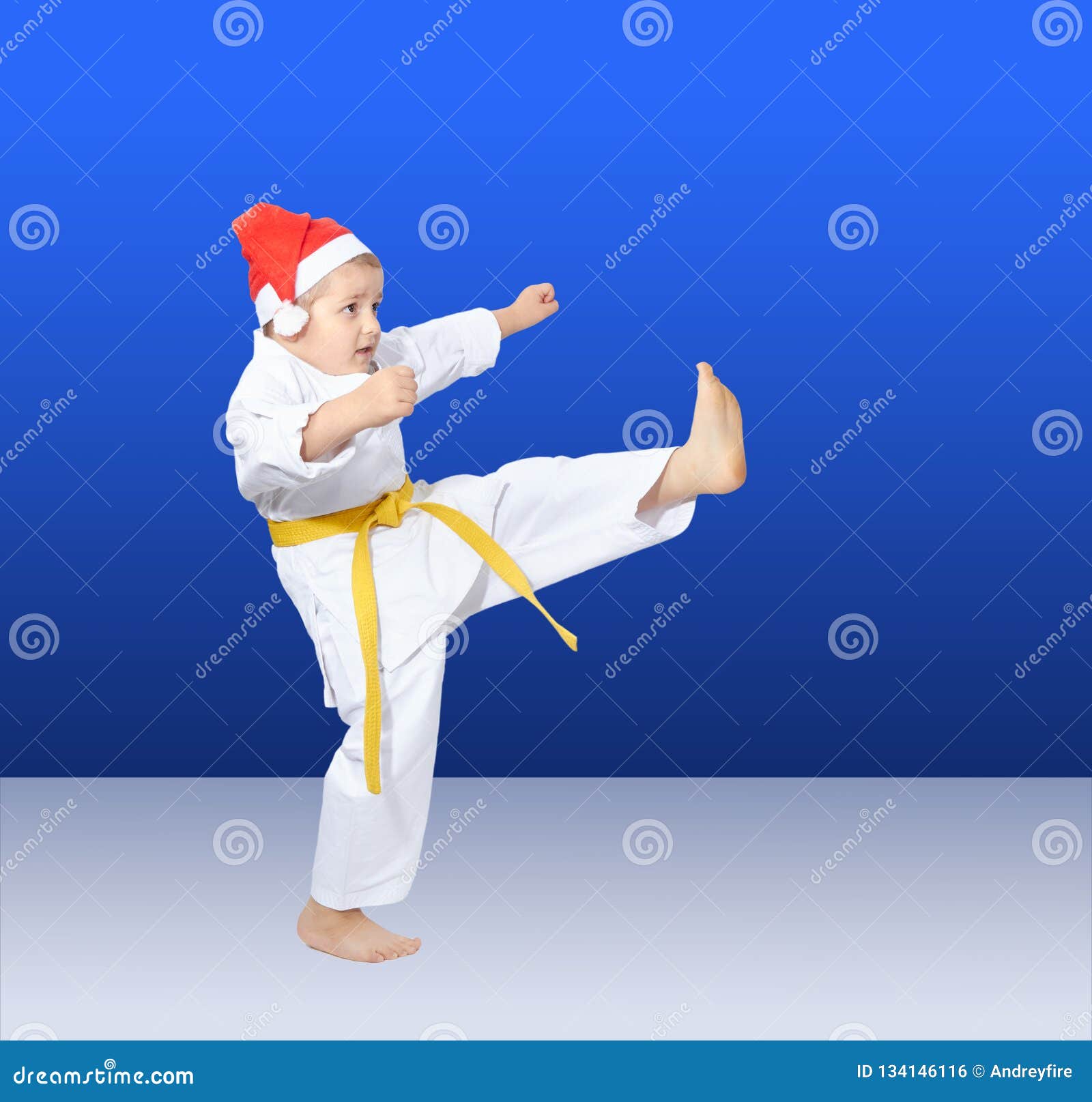 Boy in a Cap of Santa Claus Hits a Kick Leg Forward Stock Photo - Image ...