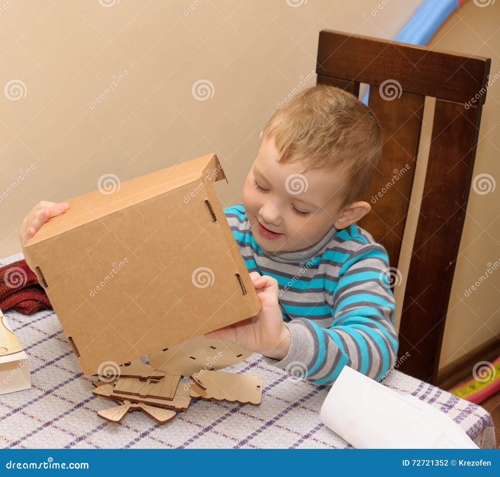 Boy with a cardboard box stock photo. Image of play, happiness - 72721352