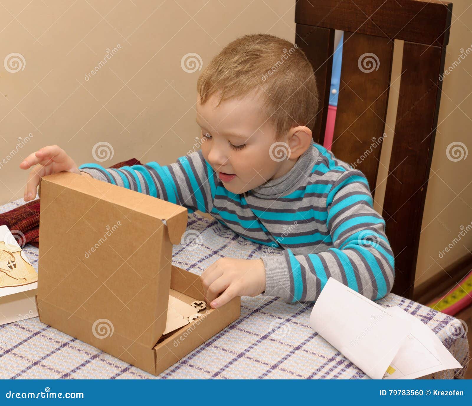 Boy with a cardboard box stock photo. Image of laughing - 79783560
