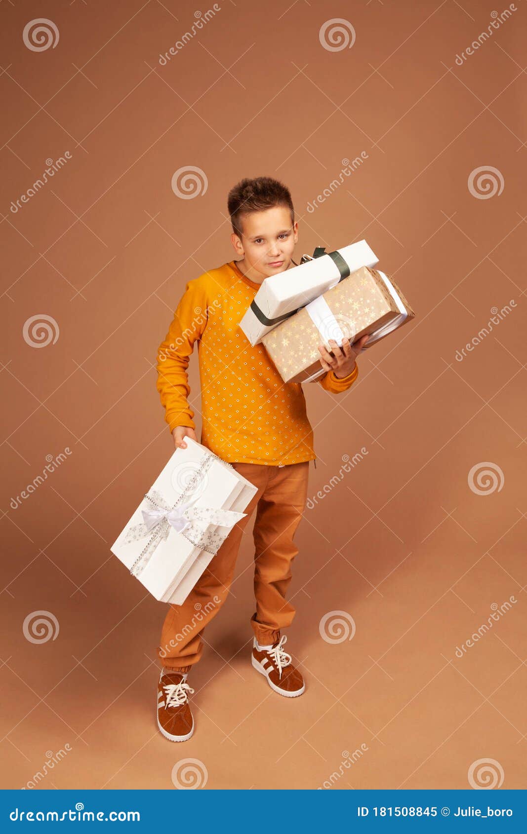 The Boy Carries Three Large Boxes with Gifts Stock Image - Image of ...