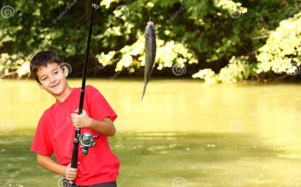 A boy catch a fish stock image. Image of hook, line, object - 20854455
