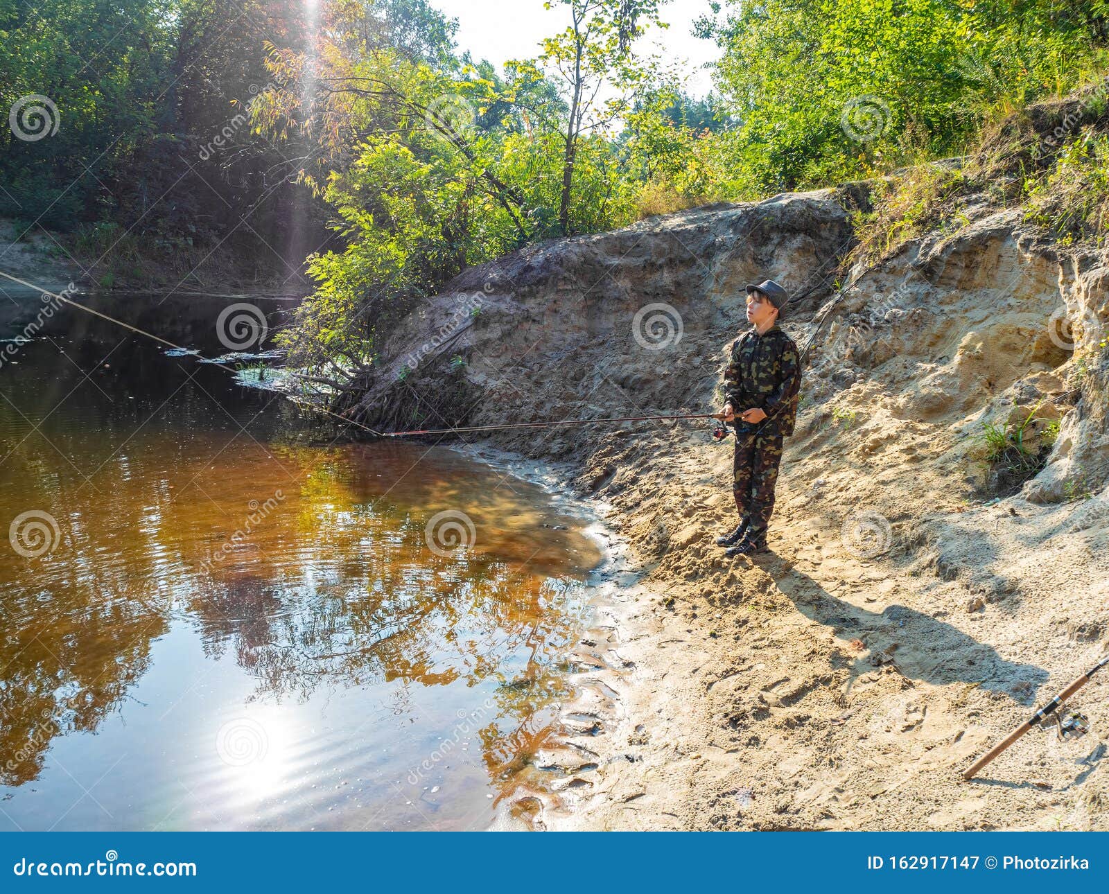 Boy Catches a Fish on a Spinning Stock Image - Image of fishing, nature ...