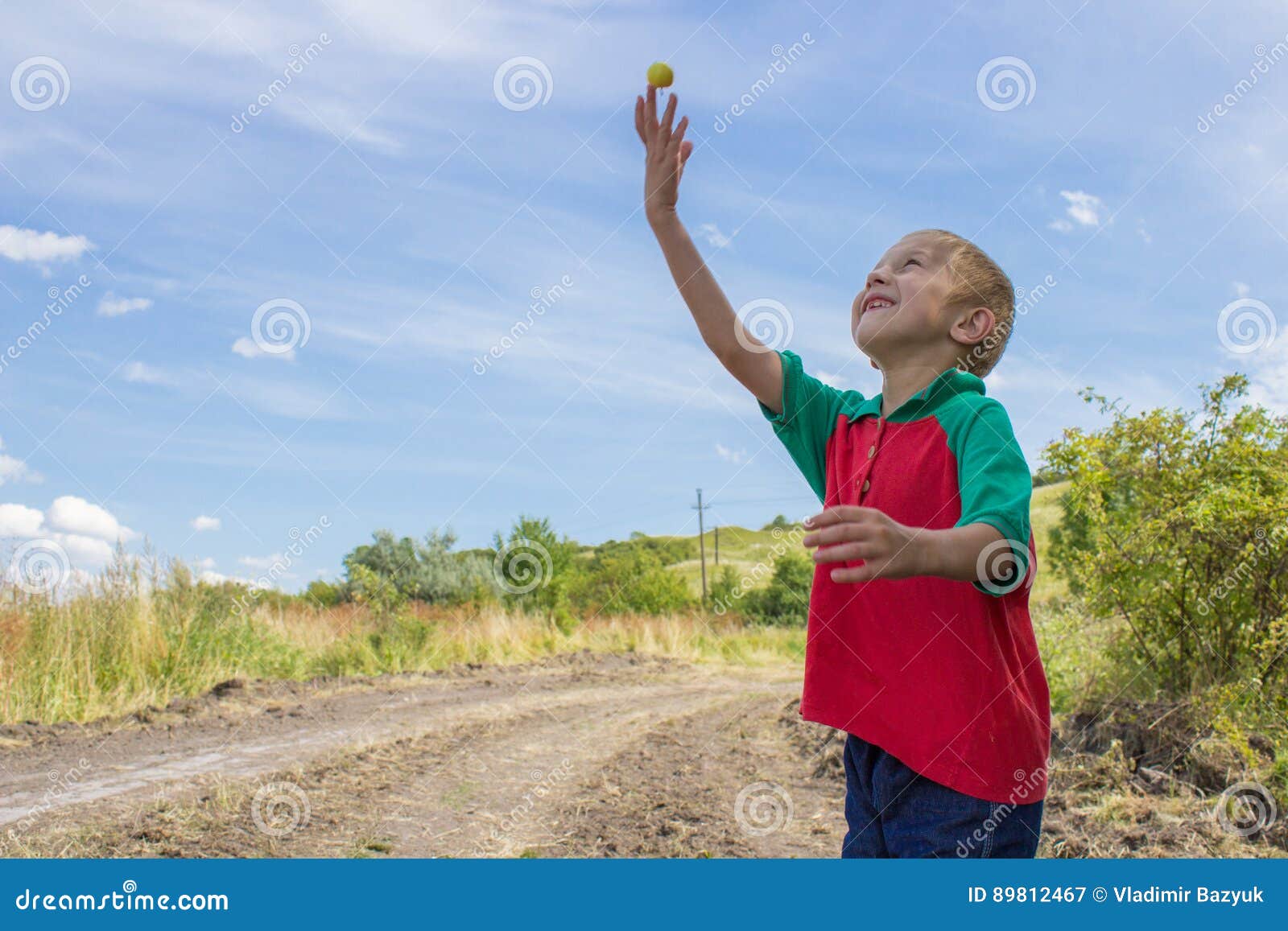 Boy catching an apple stock image. Image of happiness - 89812467