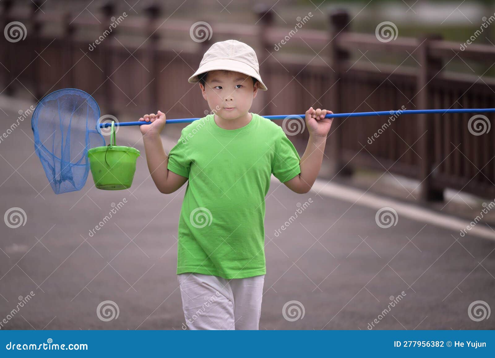 Boy Catching Fish with a Fishing Net Stock Photo - Image of river ...