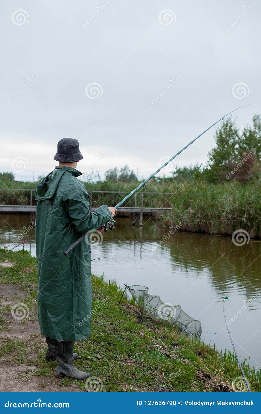 The Boy is Catching a Net by the Lake Stock Photo - Image of water ...