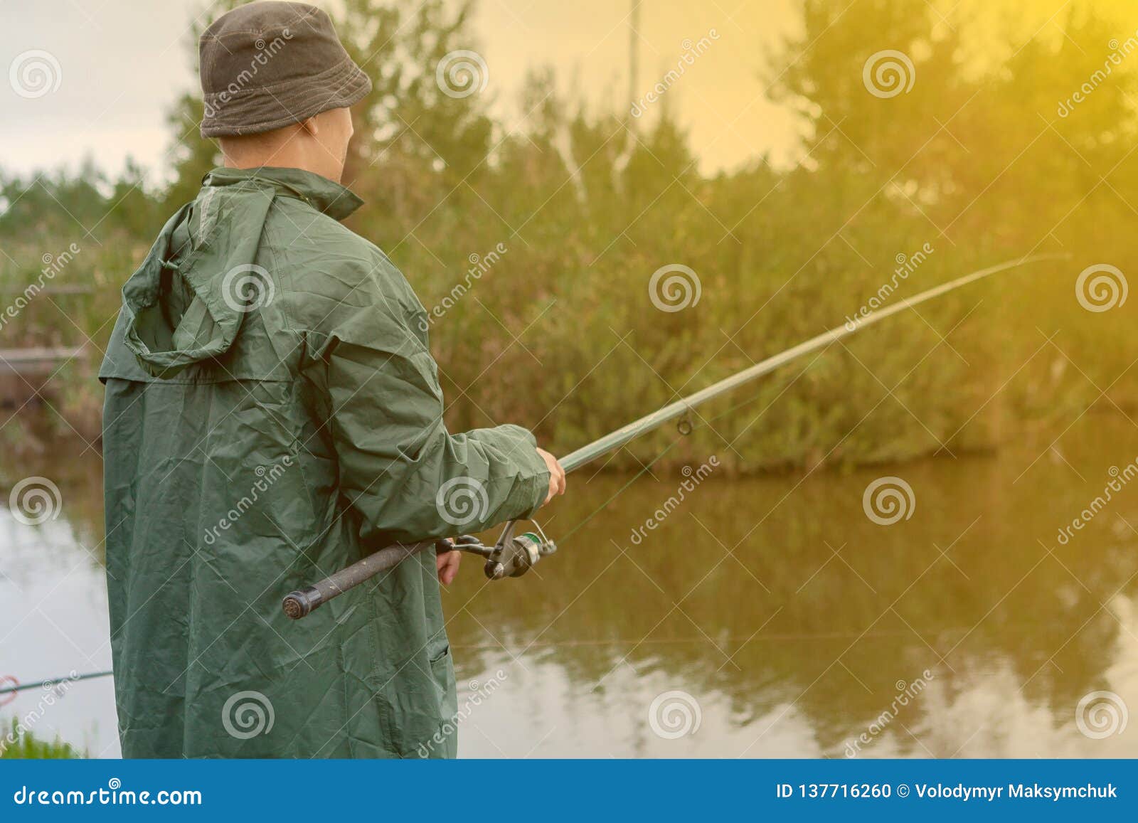 The Boy is Catching a Net by the Lake Stock Photo - Image of pond, fish ...