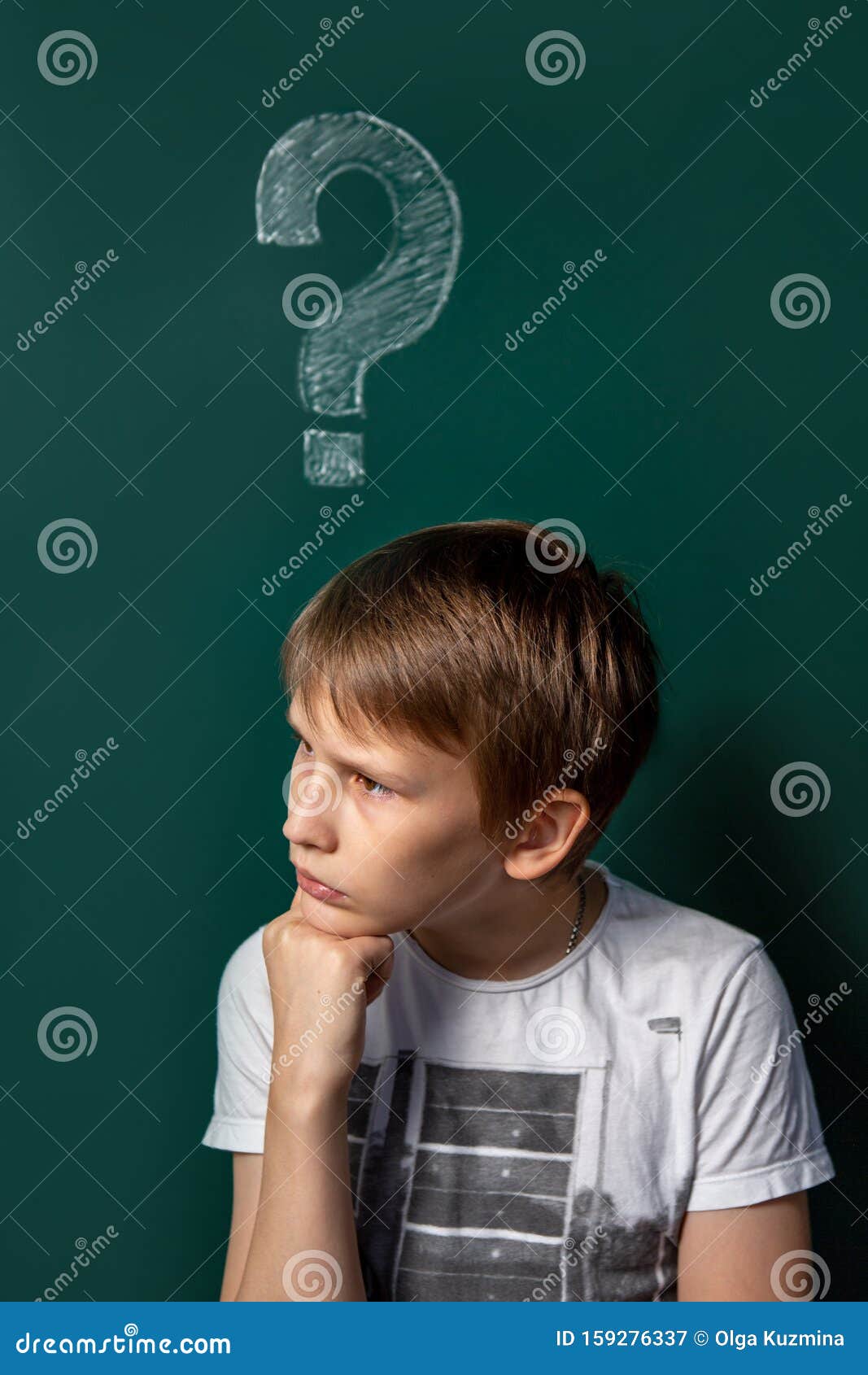 A Boy of Caucasian Appearance on a Green Background. Thinking the ...