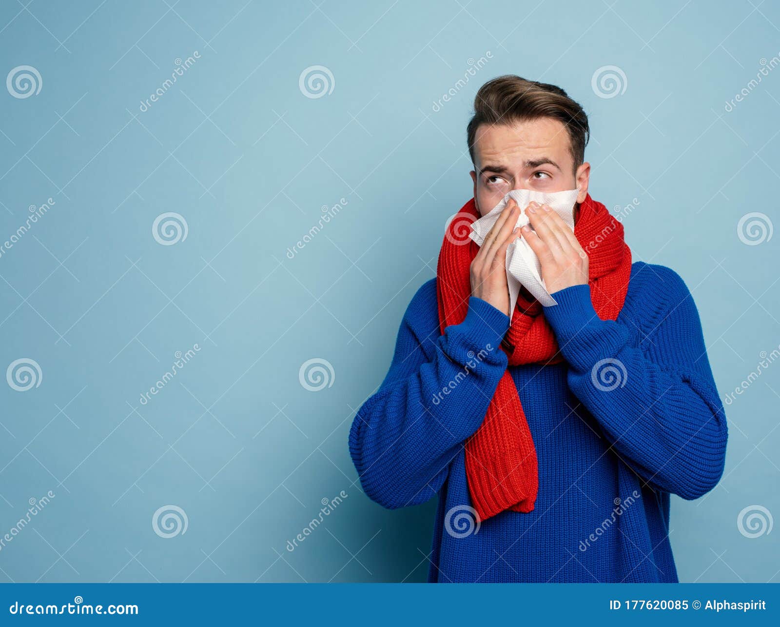 Boy Caught a Cold and Has Cold Chills. Studio on Cyan Background Stock ...