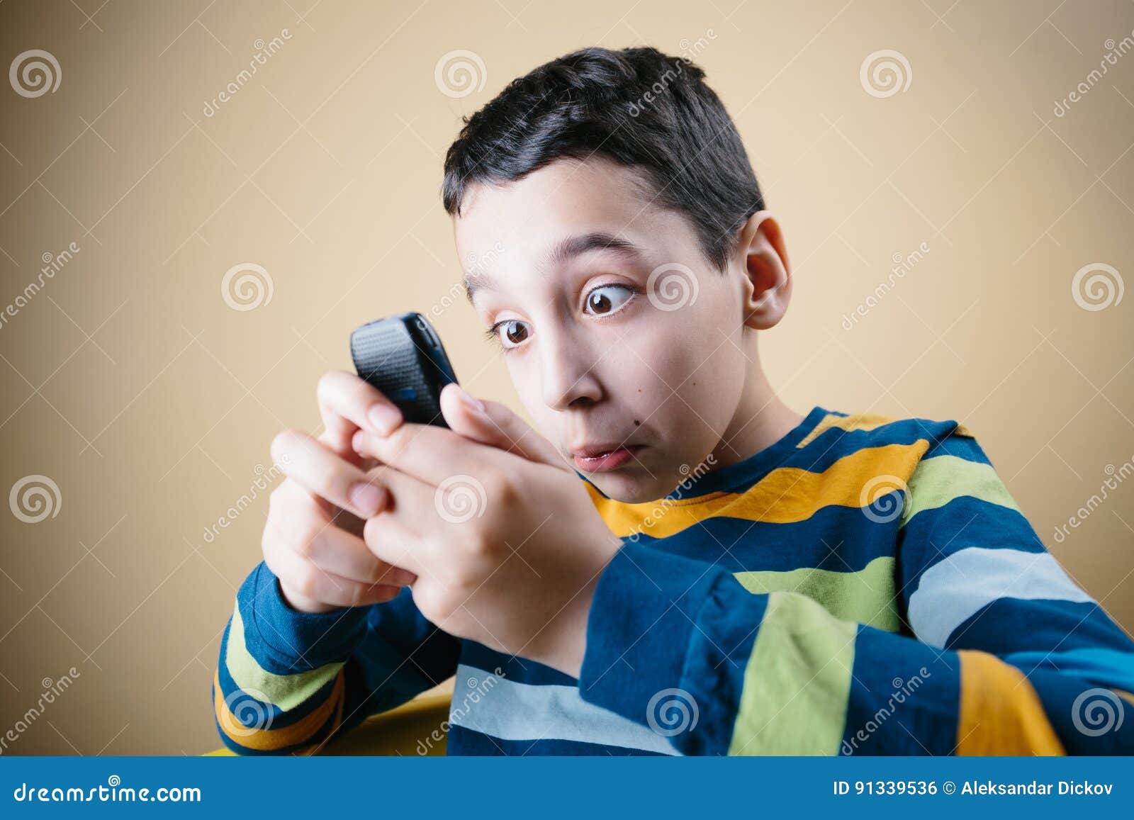 Boy with cell phone stock photo. Image of looking, expressions - 91339536